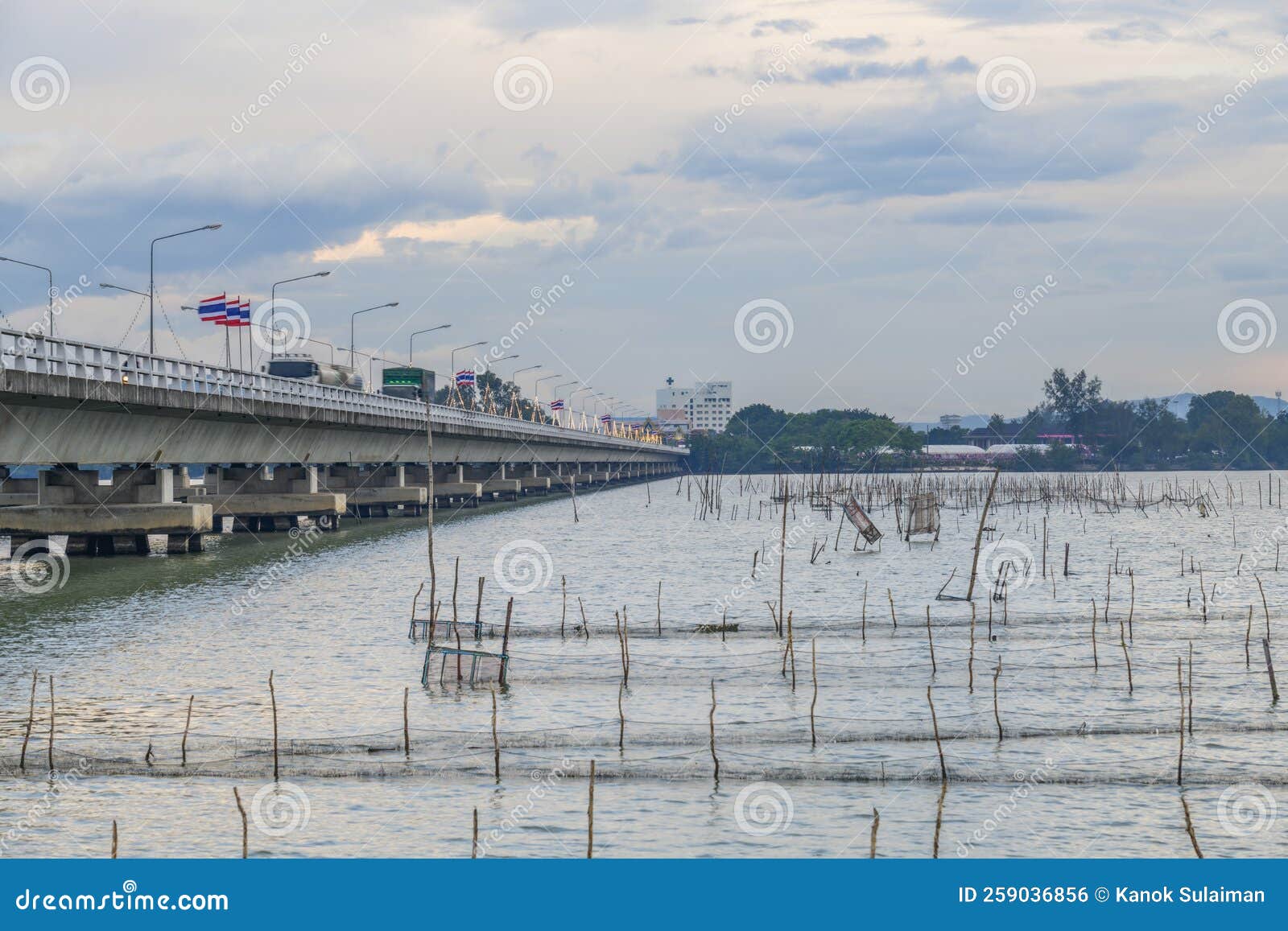 Car Driving on Bridge with Traditional Fishing in Lake Stock Photo ...