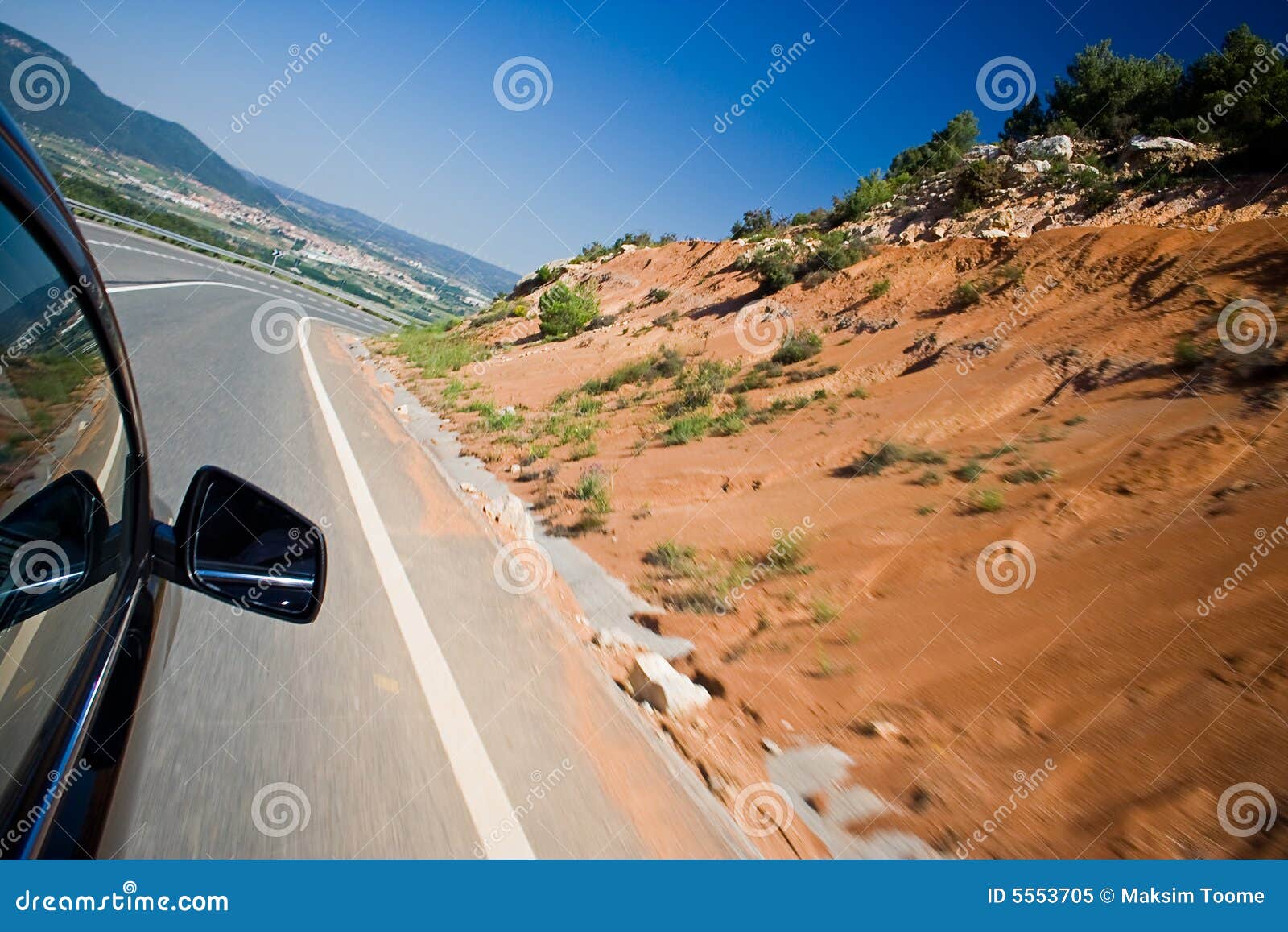Car driving fast on a road stock image. Image of shrub - 5553705