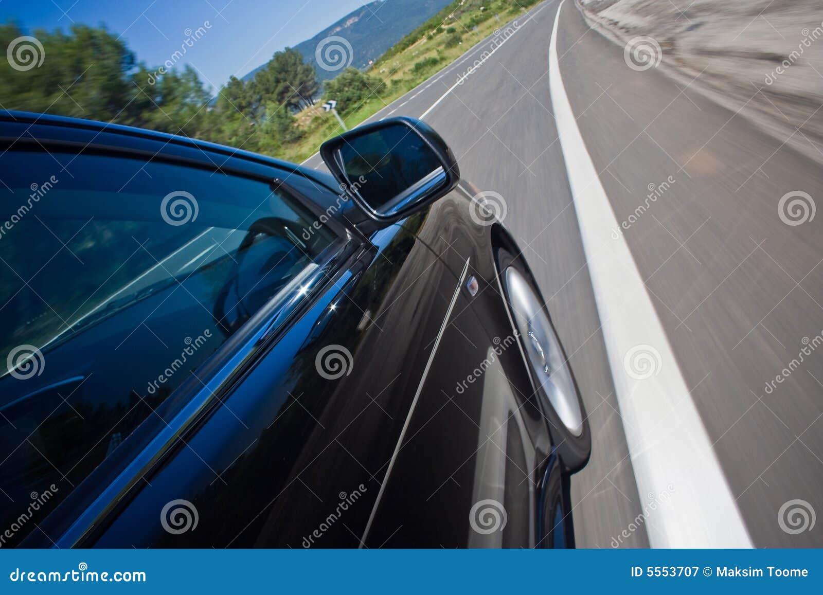 Car driving fast on a road stock image. Image of mirror - 5553707