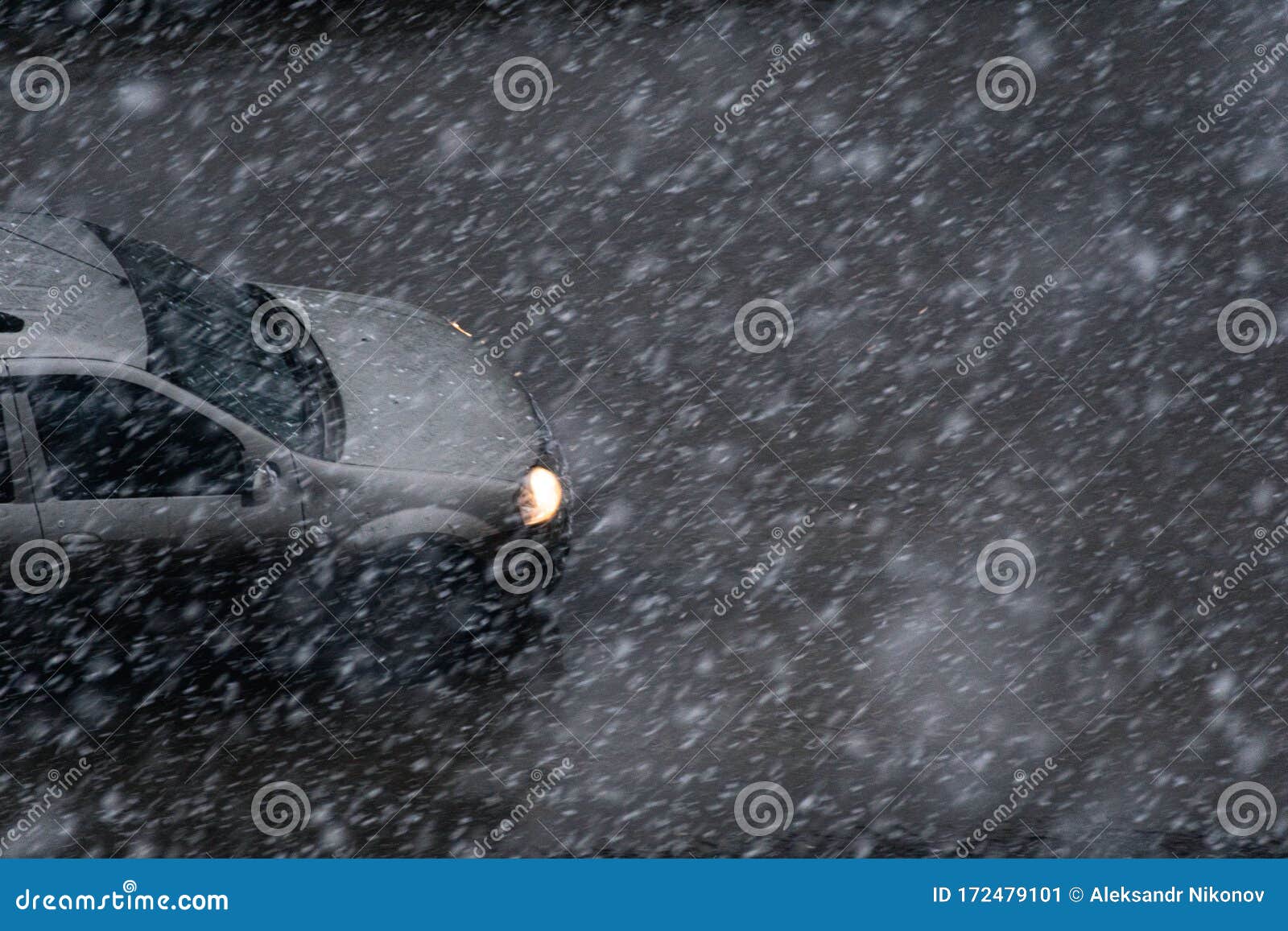 Car Driving through Heavy Snow with Headlights on Stock Image - Image ...