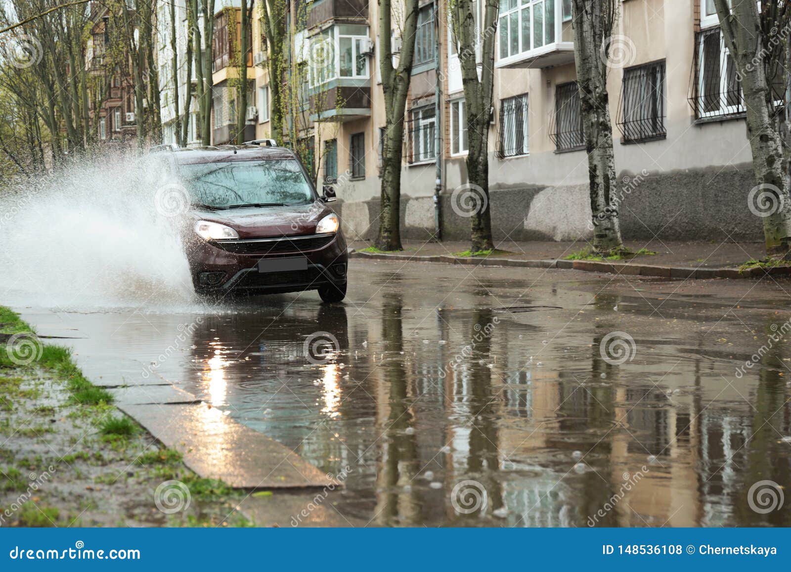 Car Driving through Large Puddle Outdoors Stock Photo - Image of ...