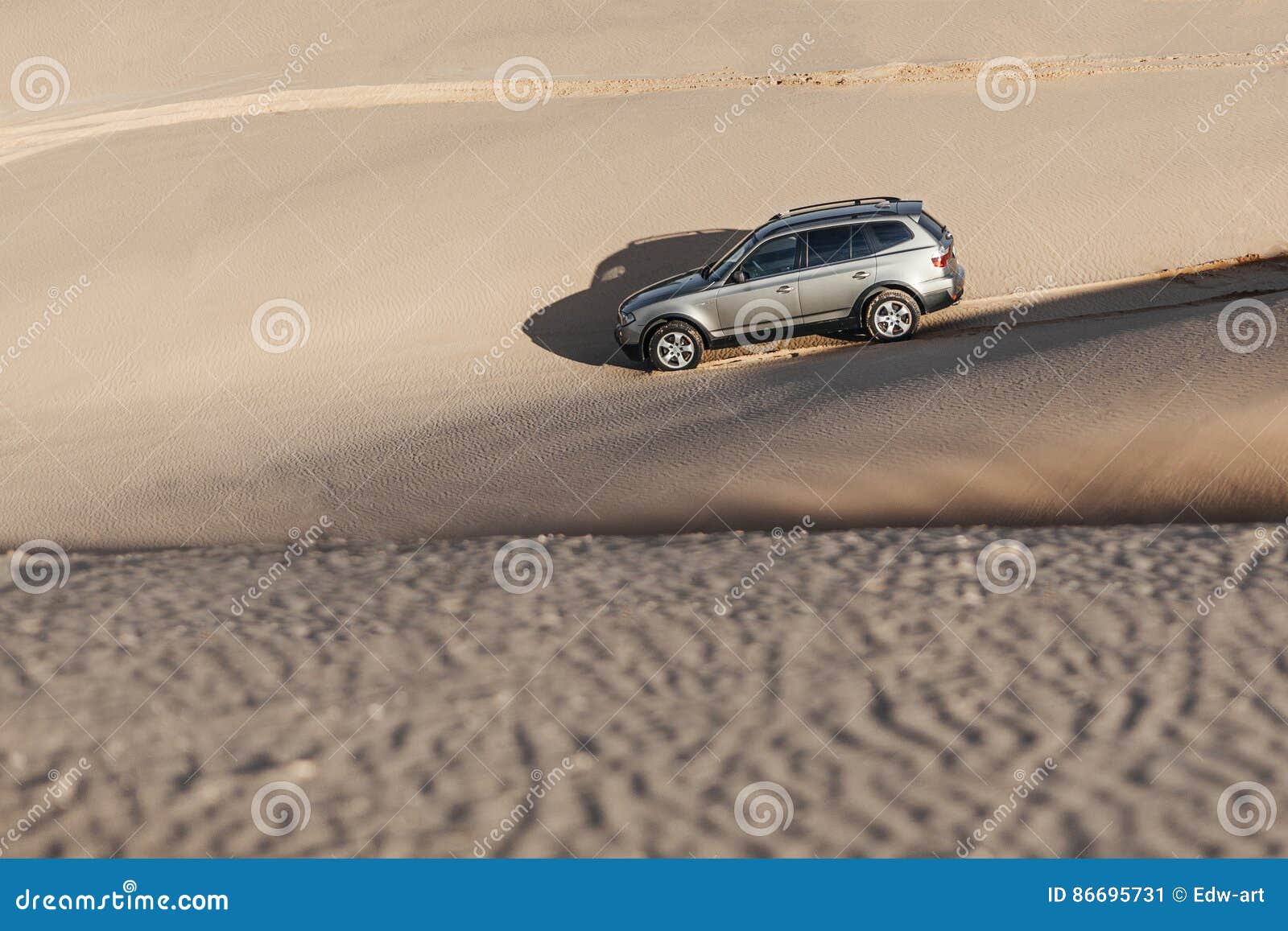 Car Driving through Sand Dune Stock Image - Image of daytime, desert ...
