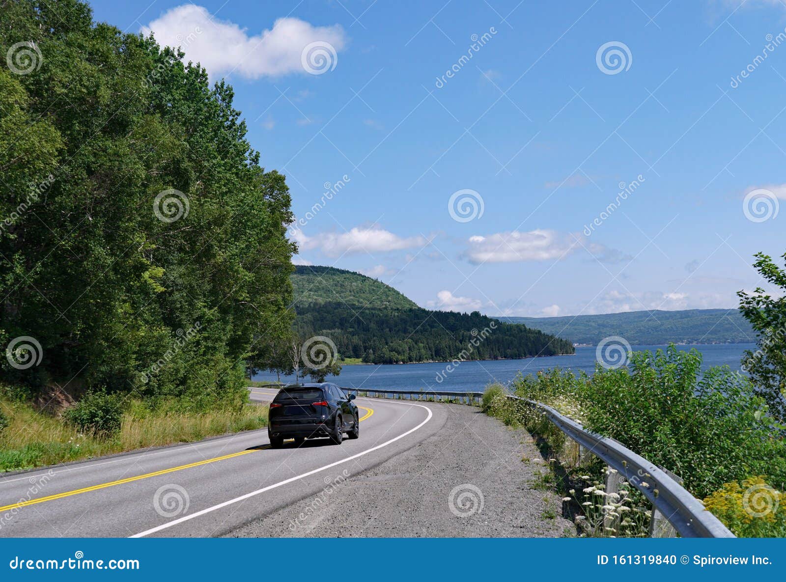 Car Driving on a Scenic Highway Stock Photo - Image of road, lake ...