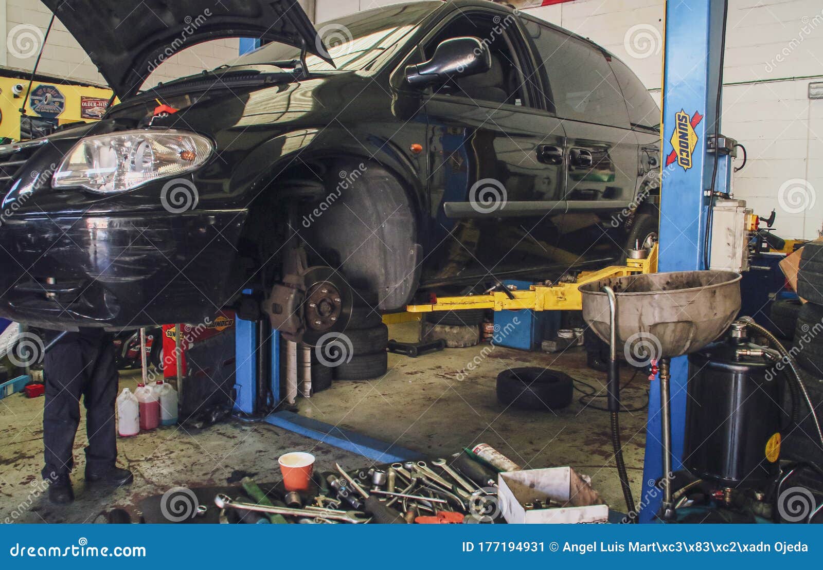Car Under Repair in a Mechanical Workshop. Editorial Photo - Image of ...