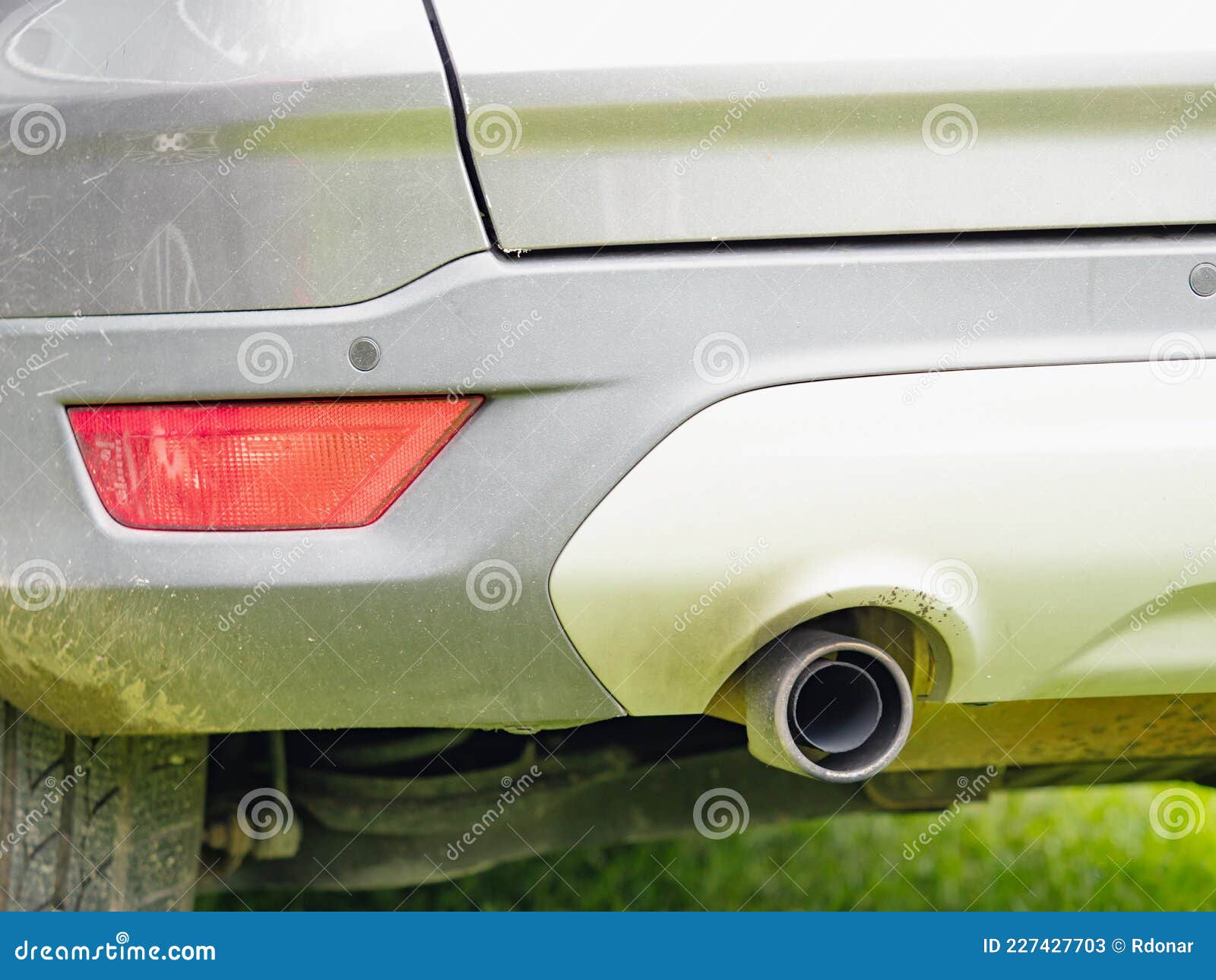 Car Exhaust Pipe, Rear Low Angle View. Car Parking on Grass Stock Image ...