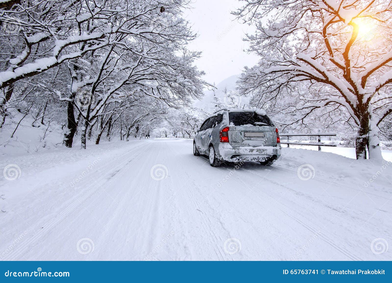 Car and Falling Snow in Winter on Forest Road with Much Snow. Stock ...