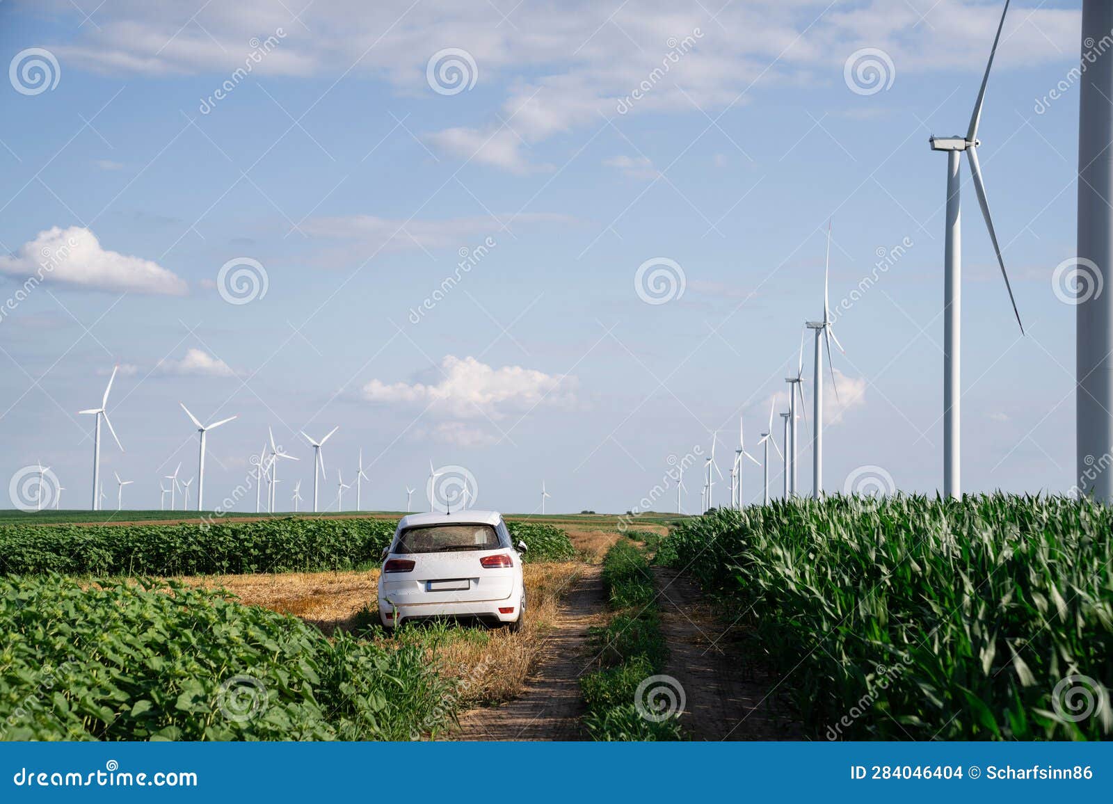 Car on a Field of Wind Turbines Stock Photo - Image of landscape, farm ...