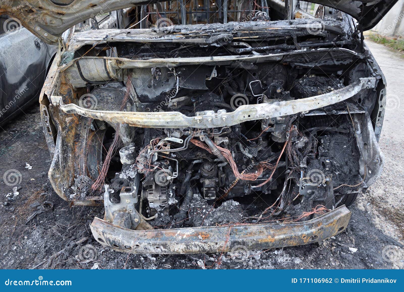 The Car after the Fire. Burnt Out Car with an Open Hood. Engine Burned ...