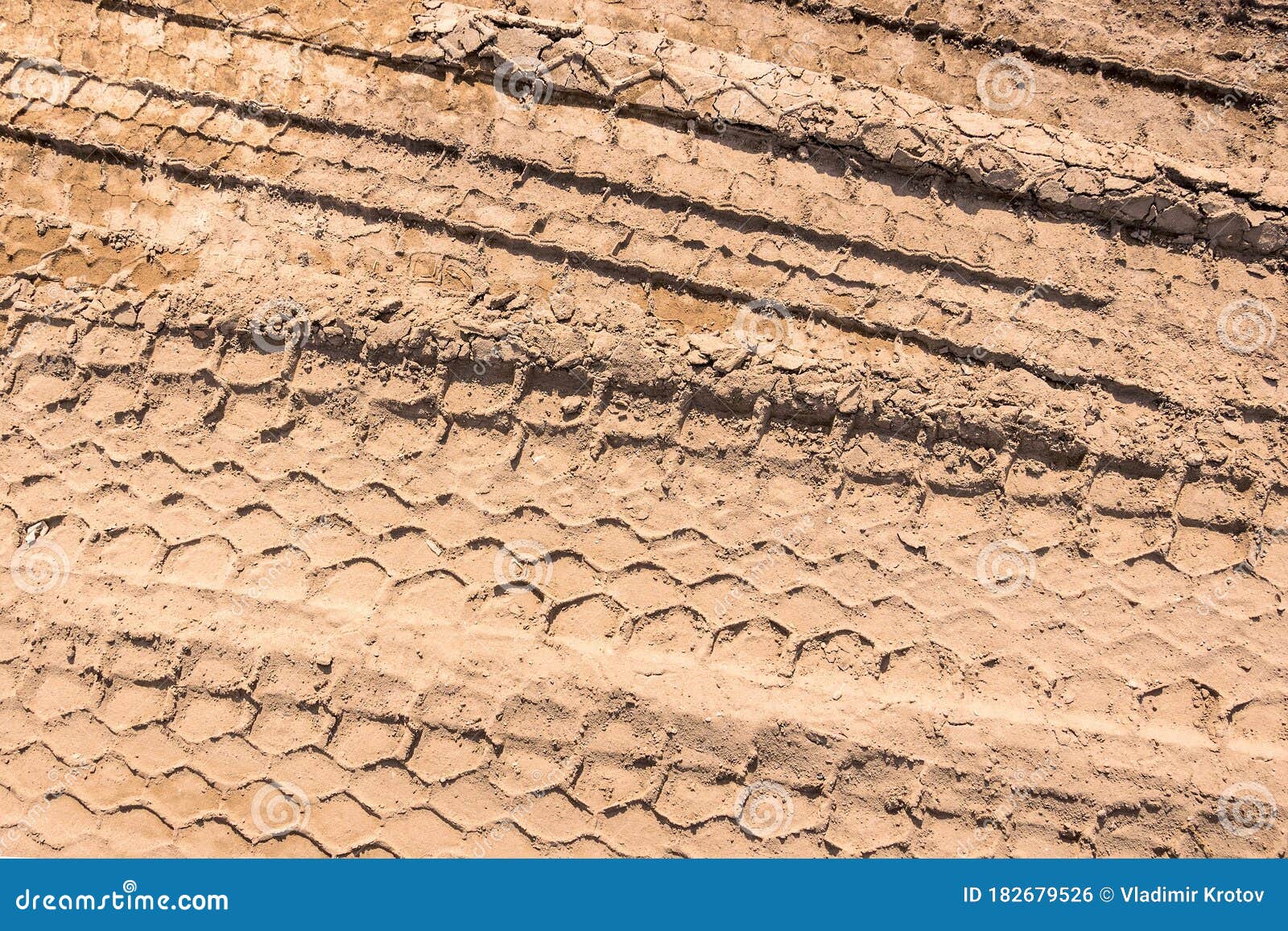 Car footprints in the sand stock photo. Image of road - 182679526