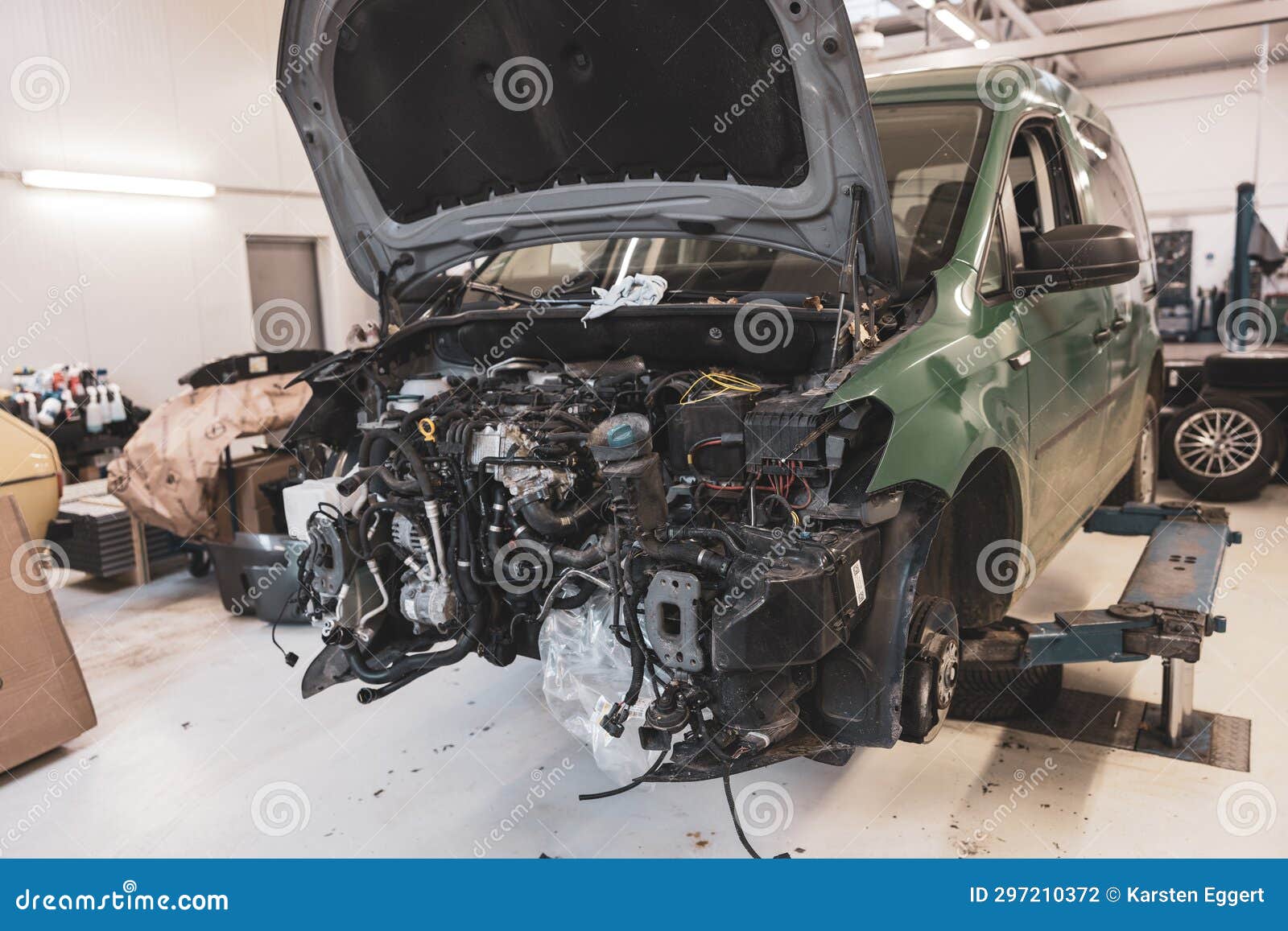 A Car without the Front and without the Hood is Standing in a Garage ...