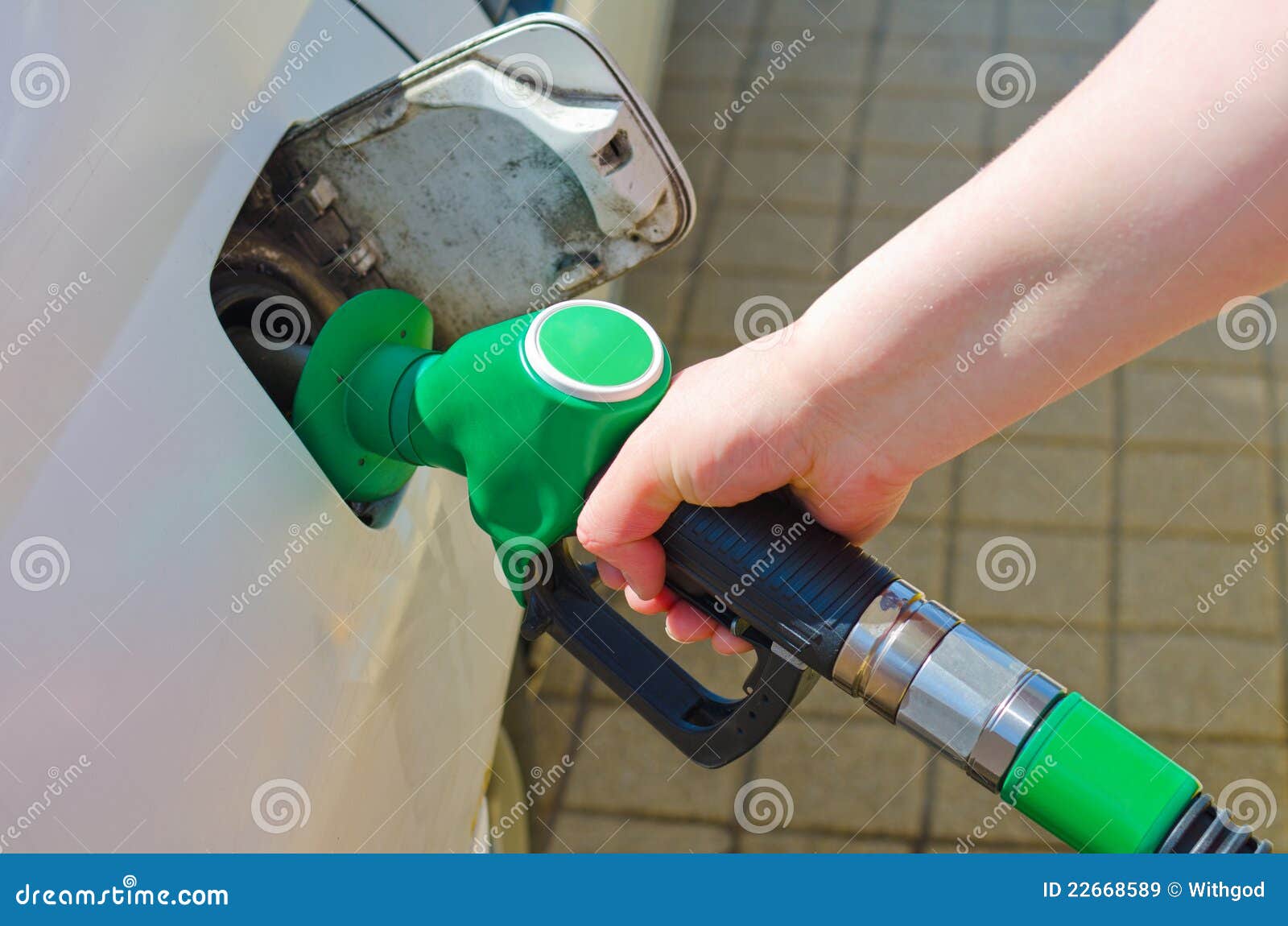 Car fuelling stock image. Image of closeup, sunny, nozzle - 22668589