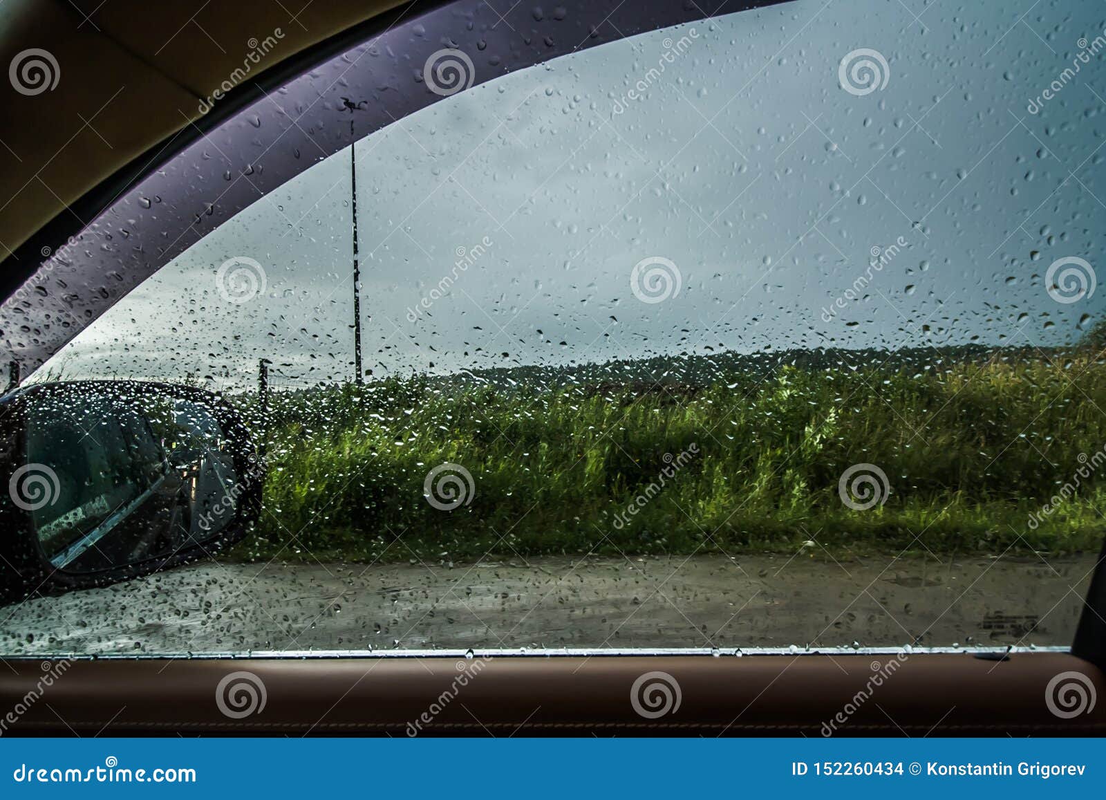 The Car Goes in the Rain. View from the Inside. Raindrops on the ...