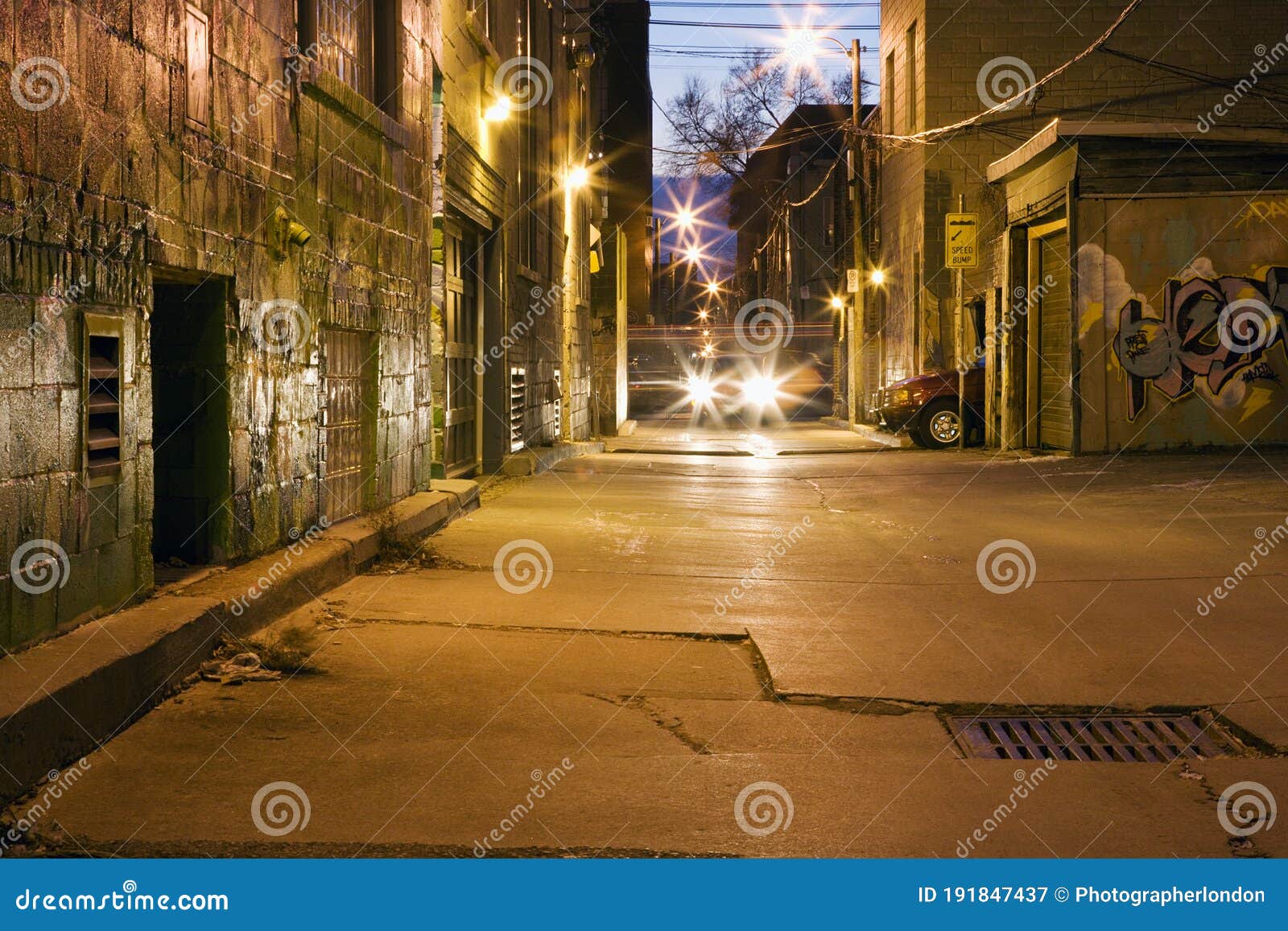 Car Head Lights in Alleyway at Dusk Stock Image - Image of blurred ...