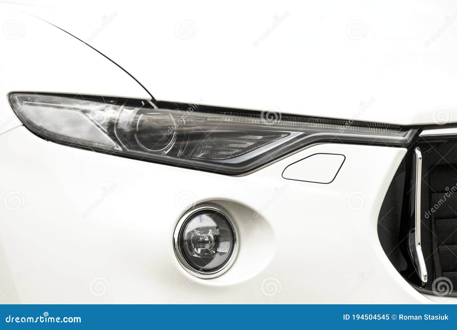 Car Headlights. Luxury Headlights. Part of a White Car Close Up Stock ...