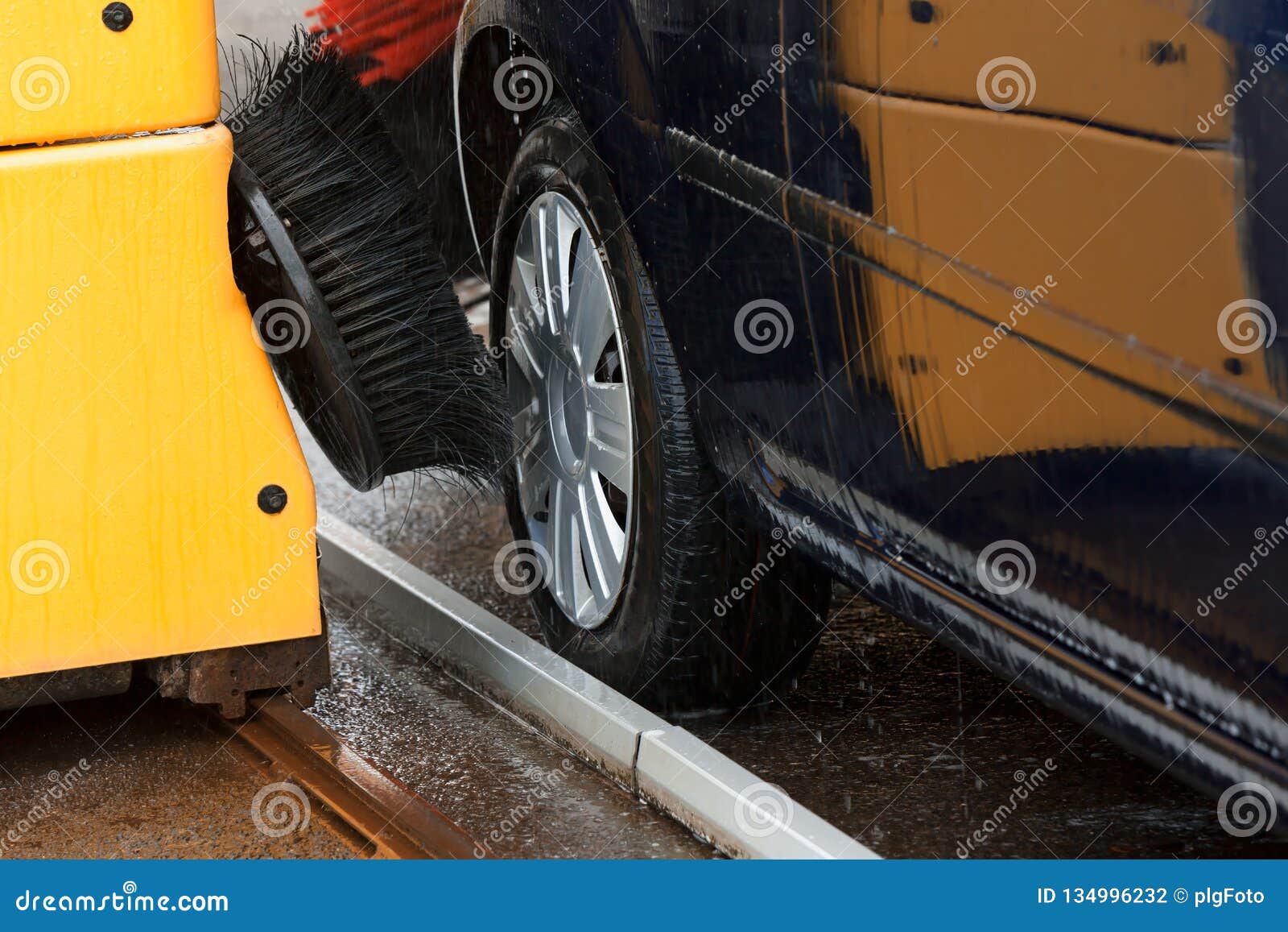 A Car Inside a Car Washing Machine while it is Working Stock Photo ...