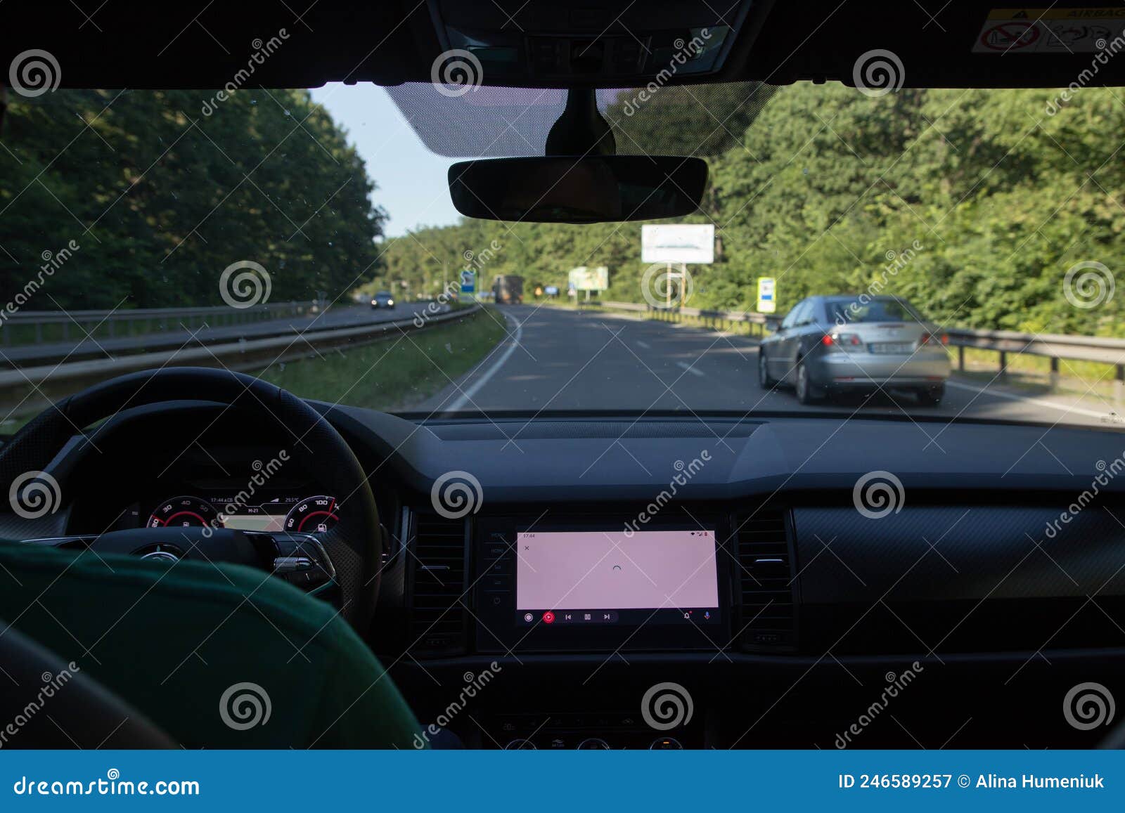 Car Interior on the Road. Steering Wheel, Dashboard and on-board ...