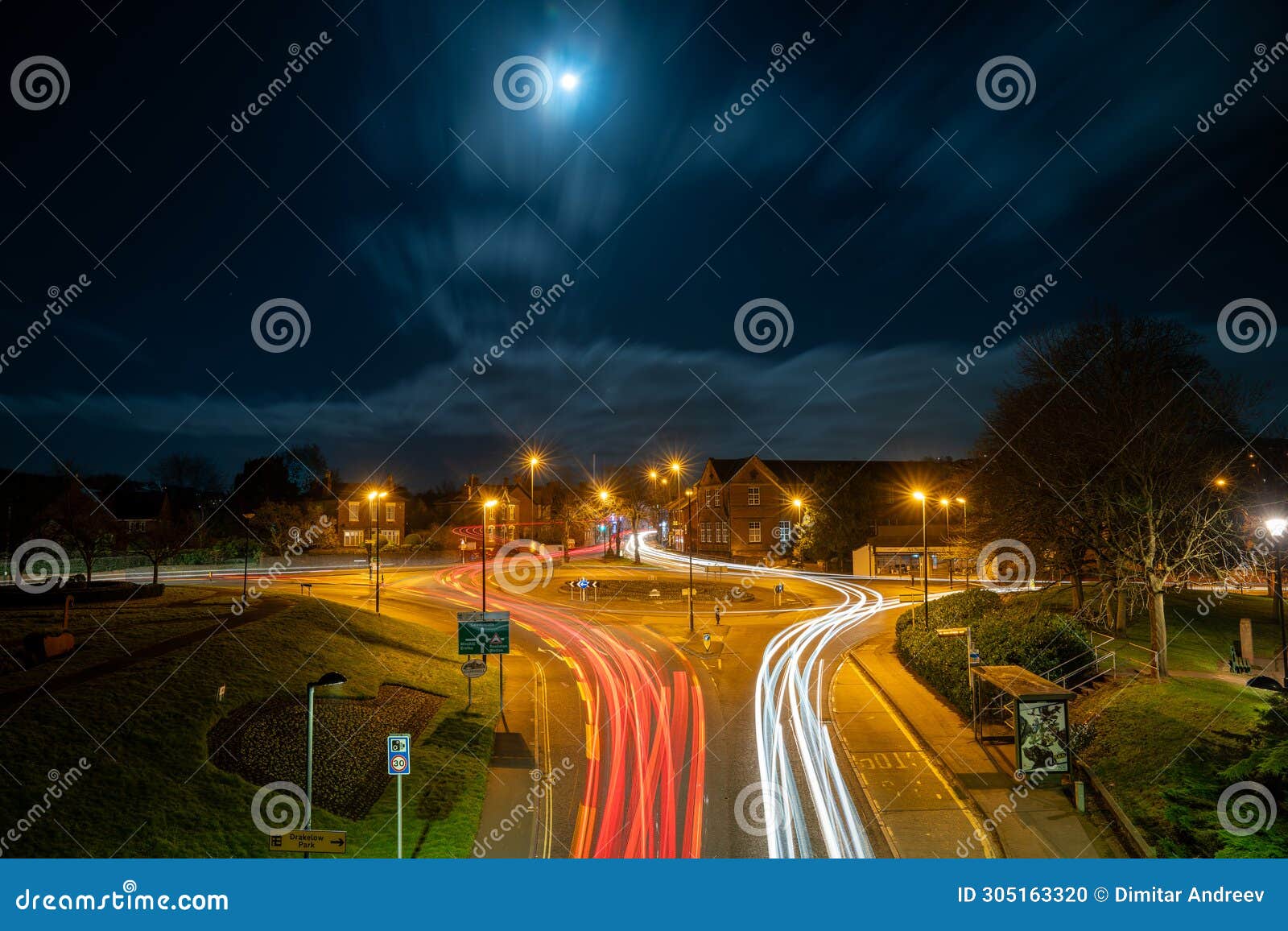 Car Light Trails on a Roundabout in a Small Town Stock Photo - Image of ...