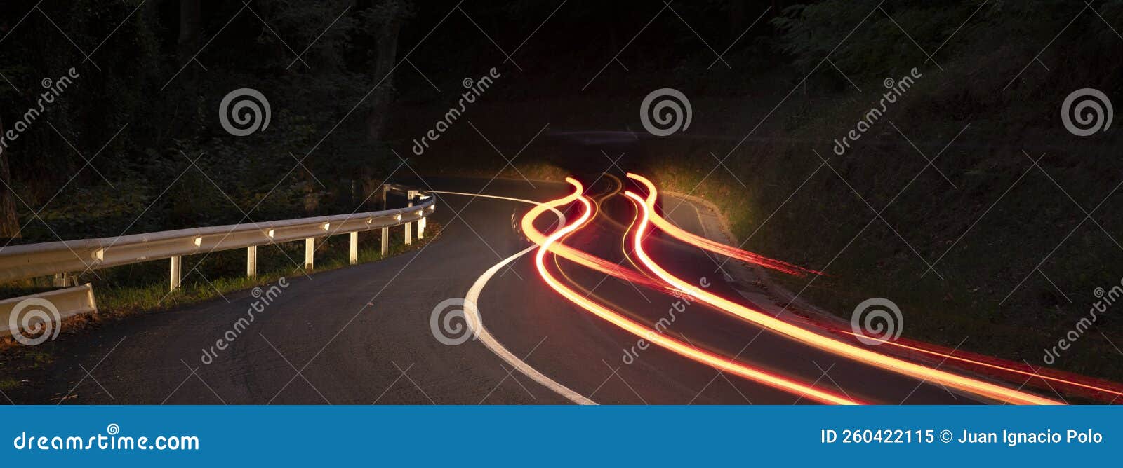 Car Lights Driving on a Curve of the Road at Night Stock Image - Image ...