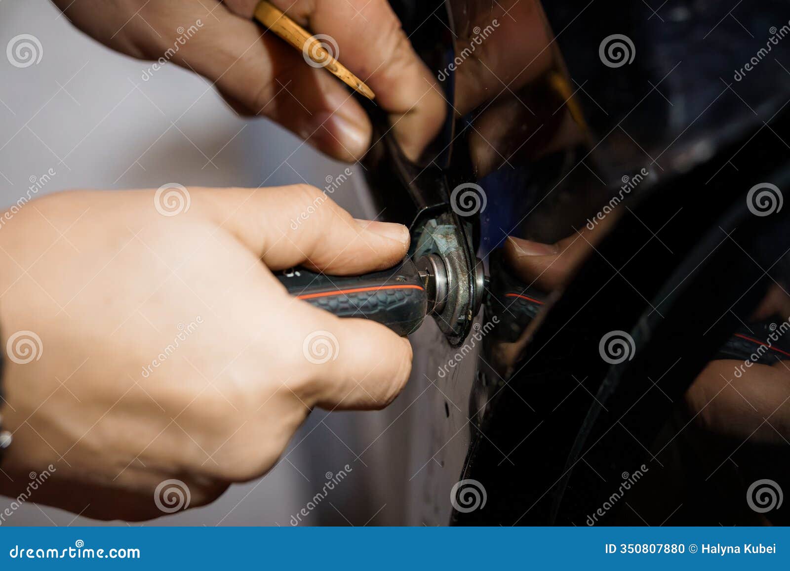 Car Maintenance: a Close-Up of a Mechanic Working on a Door Lock Stock ...