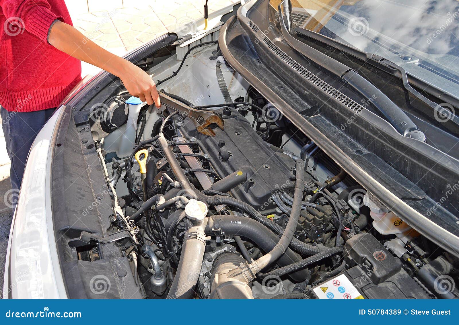 A Car Mechanic with an Adjustable Spanner - Engine Technition Stock ...