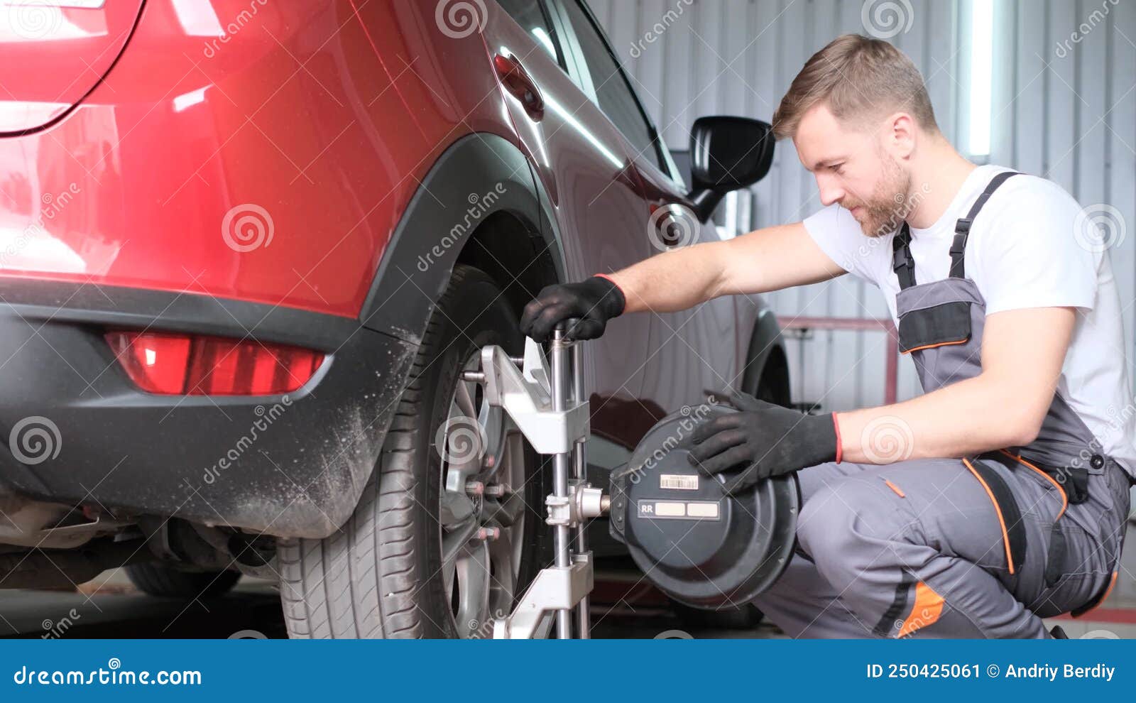 The Car Mechanic Adjusts the Car Control System. Car Service. Diagnosis ...