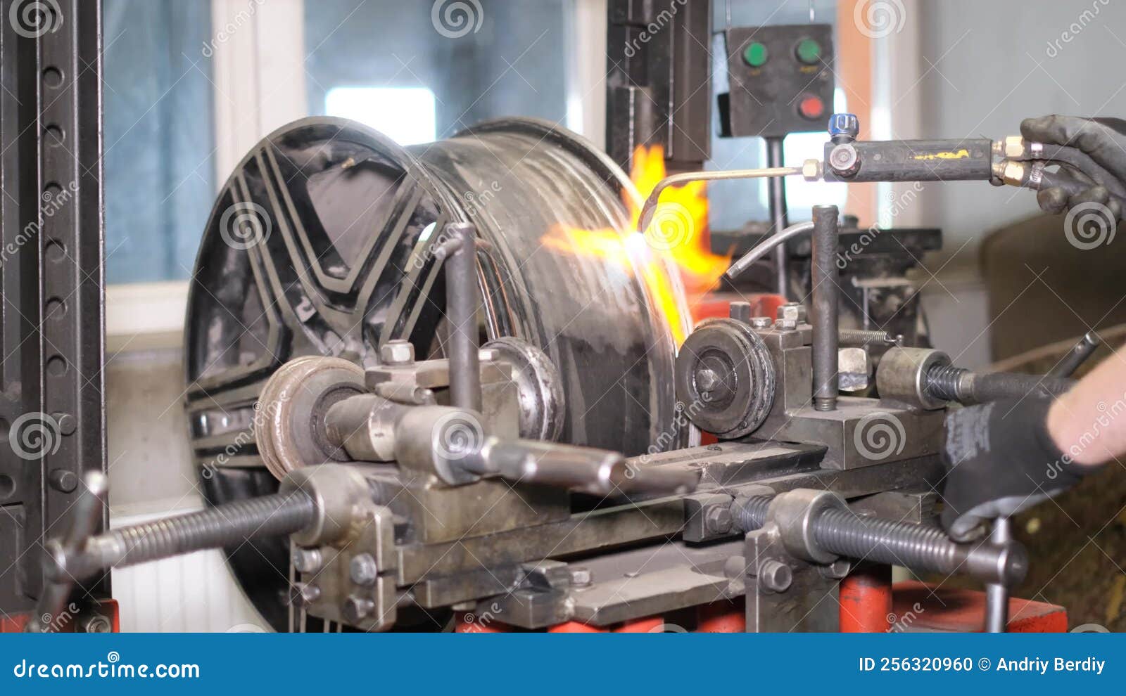 A Car Mechanic Aligns Car Rims with a Welding Machine. Alignment of ...