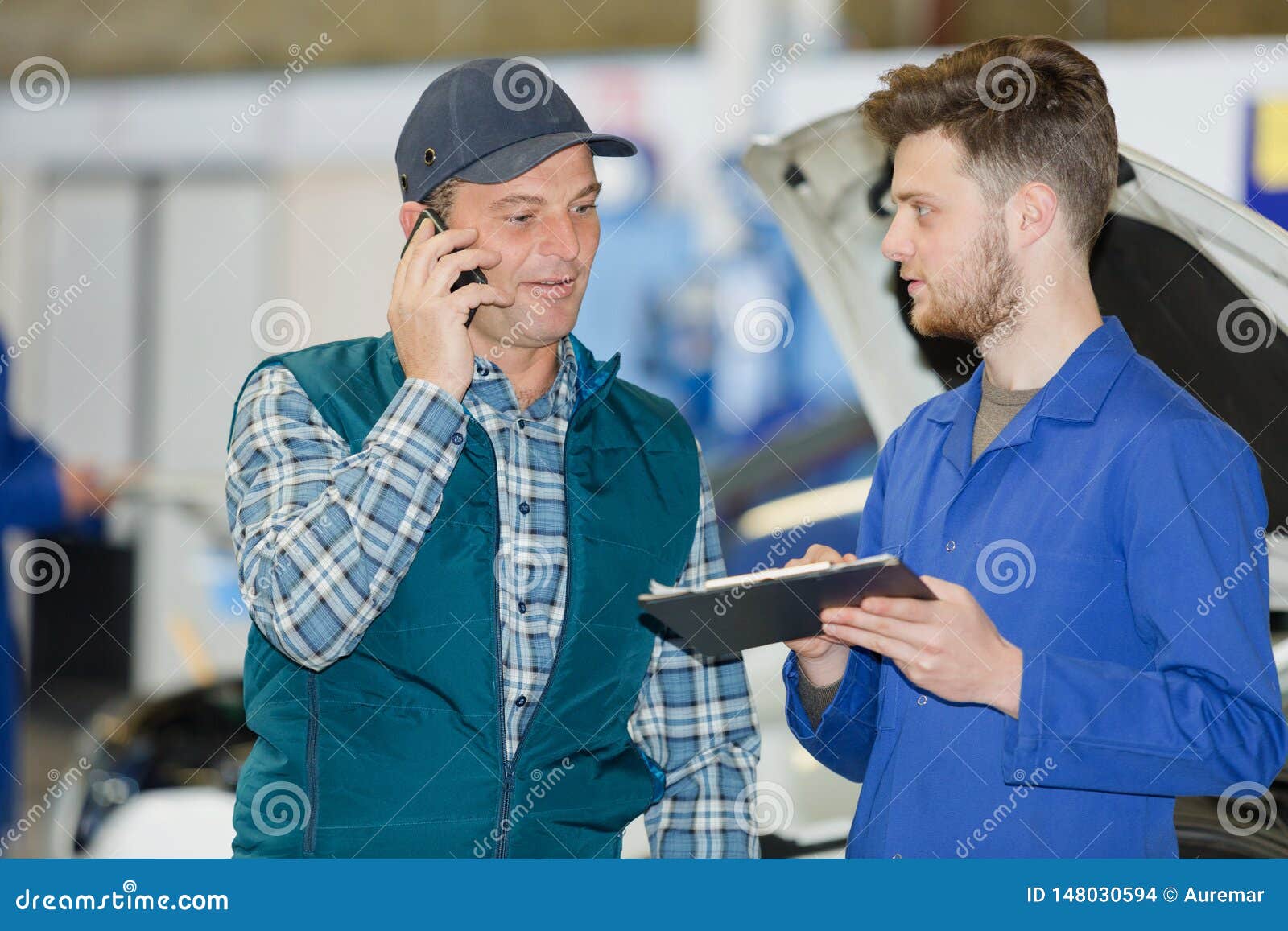 Car Mechanic and Apprentice Checking Car Engine Stock Photo - Image of ...