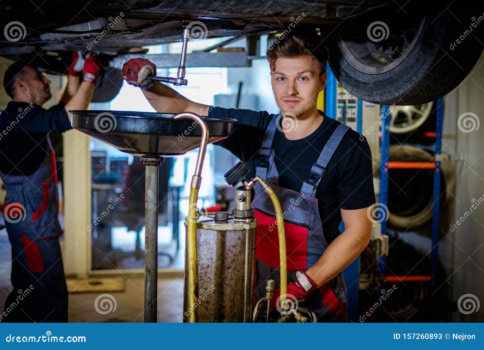 Car Mechanic Changes Oil in a Workshop Stock Image - Image of dipstick ...