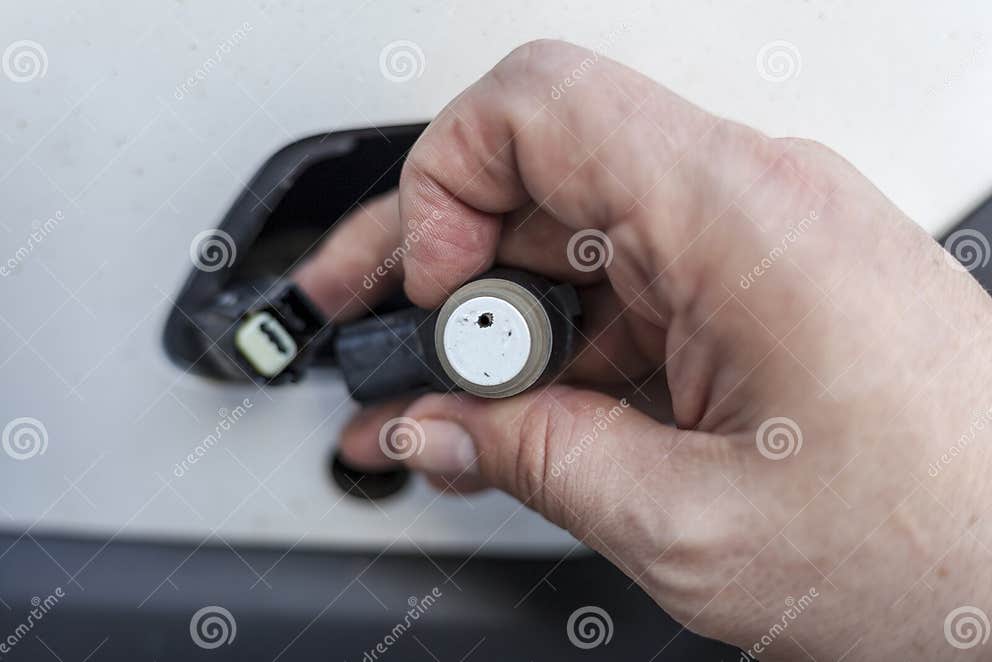 Car Mechanic Changes the Parking Sensor on the Car, the Sensor ...