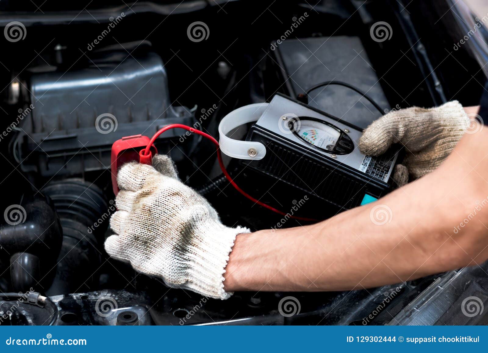 Car Mechanic Check the Battery Capacity. Stock Photo - Image of line ...