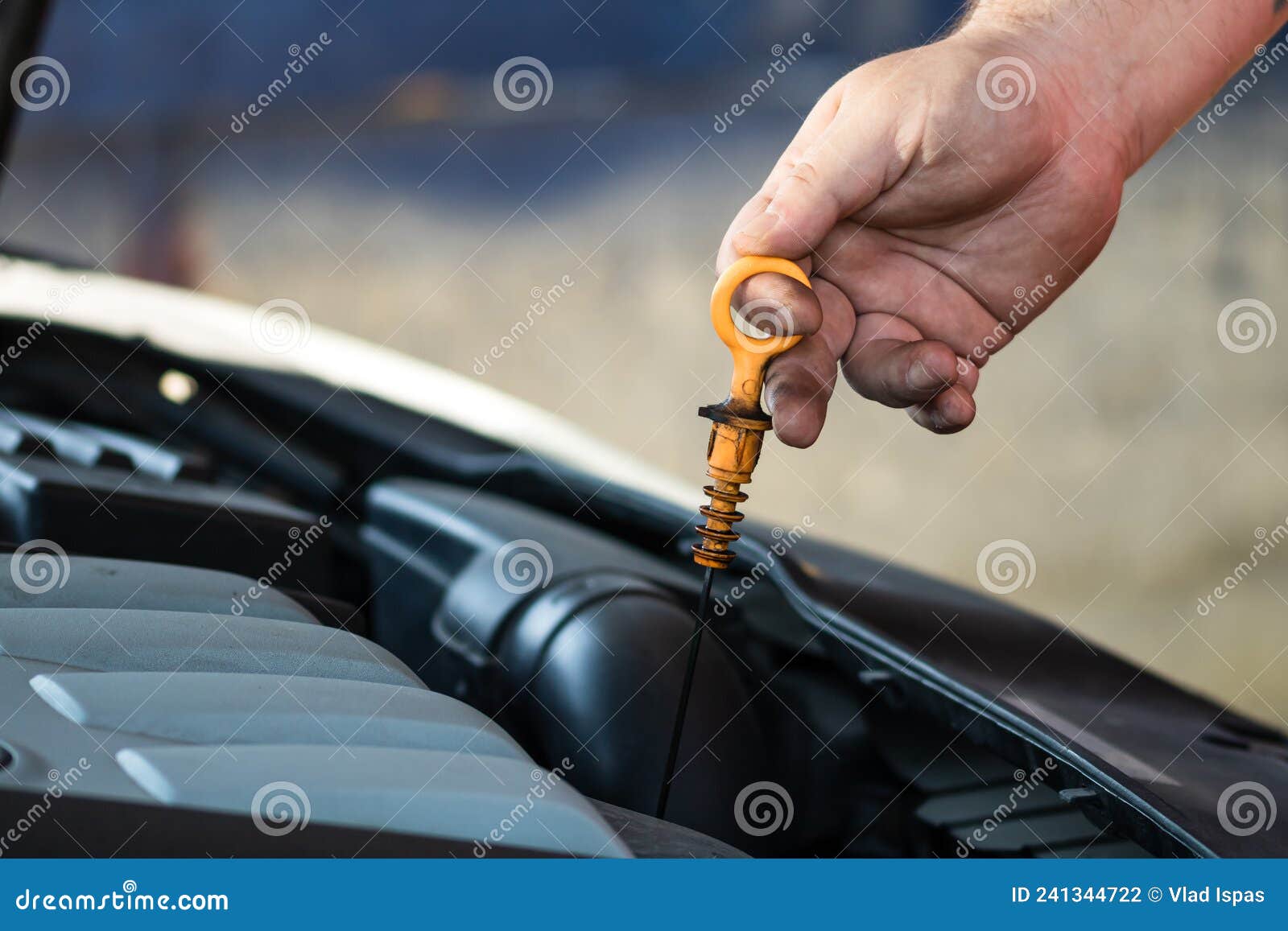Car Mechanic Checking the Engine Oil Level Stock Photo - Image of ...