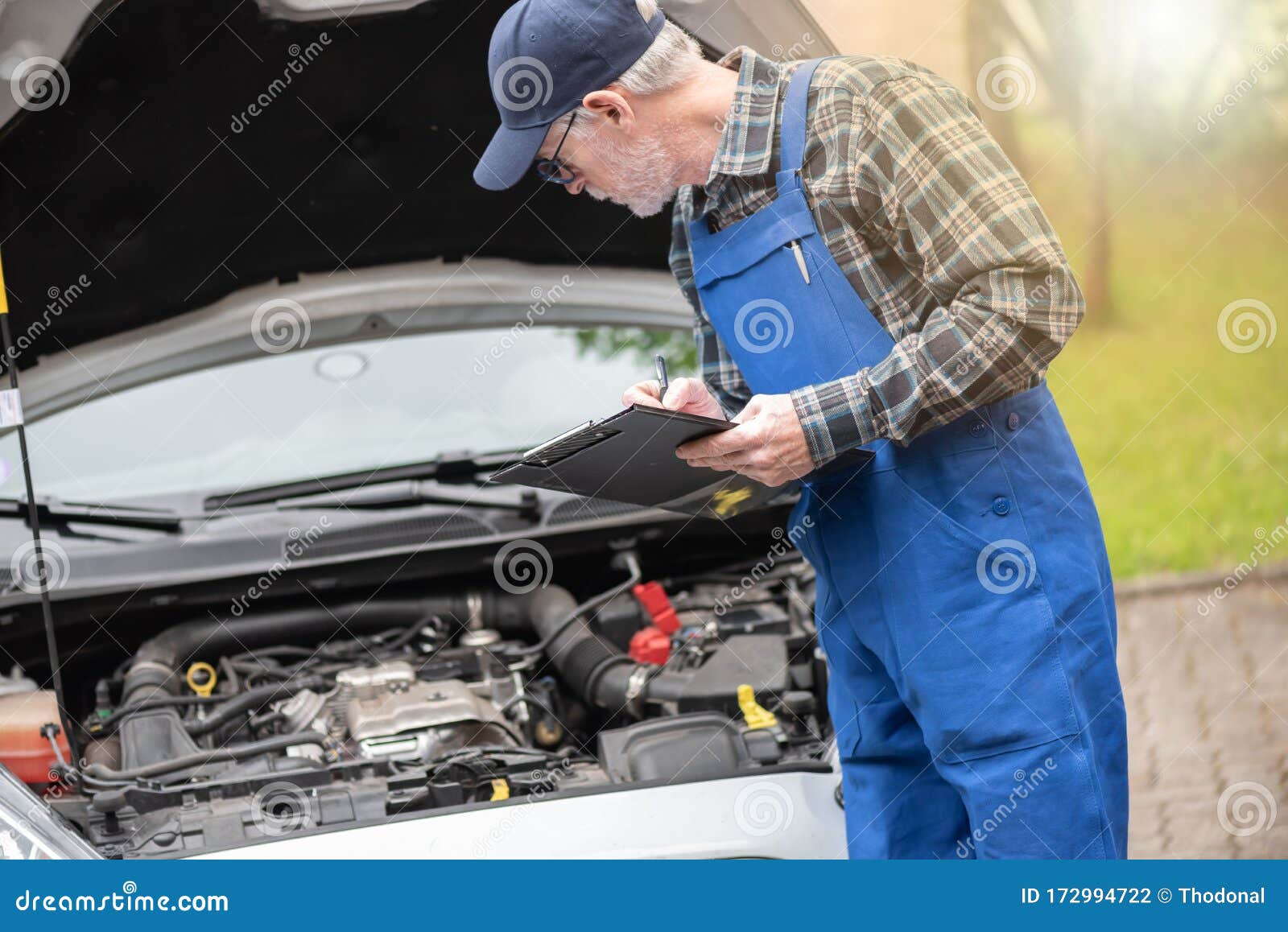 Car Mechanic Checking a Car Engine Stock Photo - Image of check, male ...