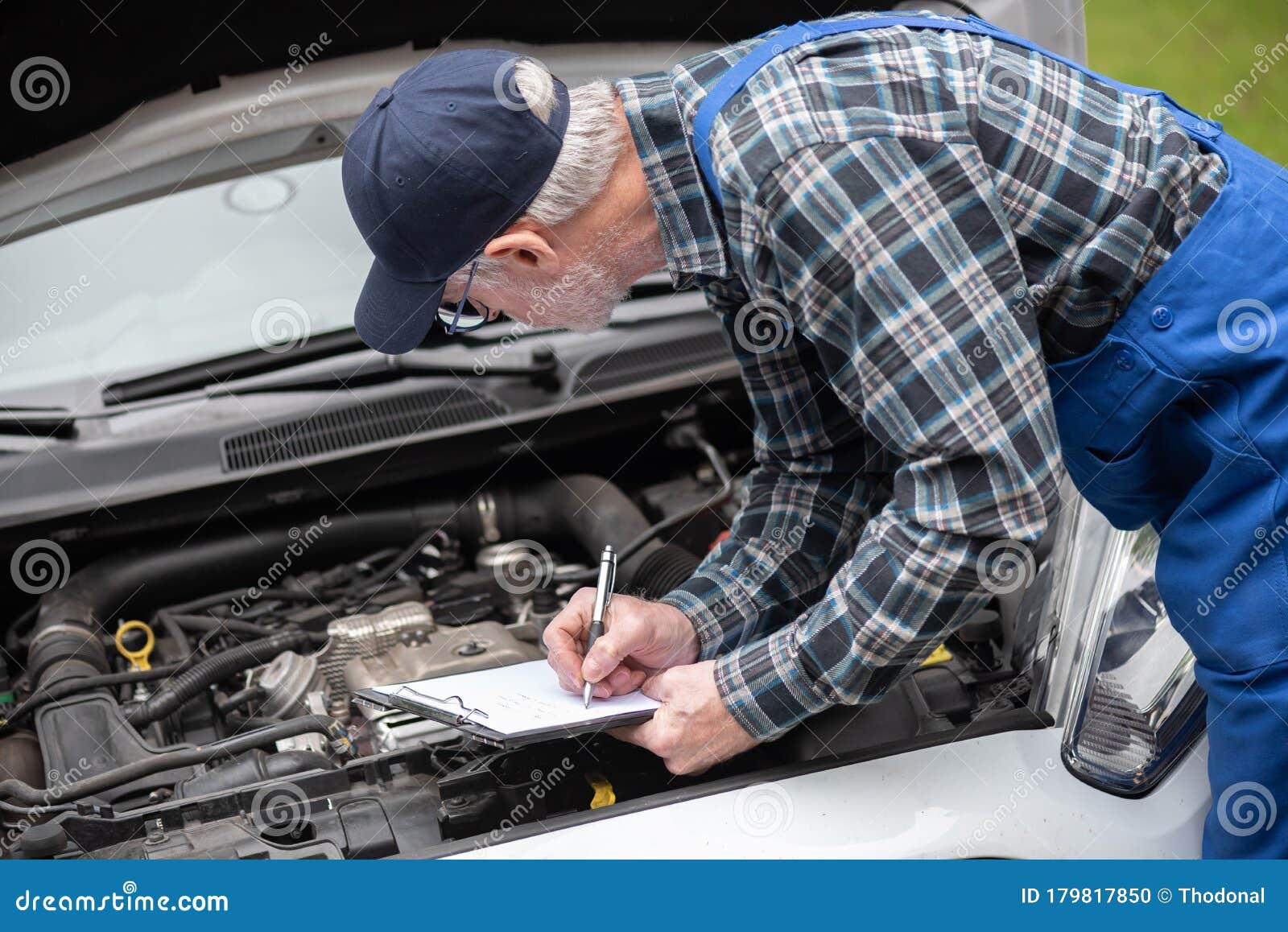 Car Mechanic Checking a Car Engine Stock Photo - Image of repairman ...