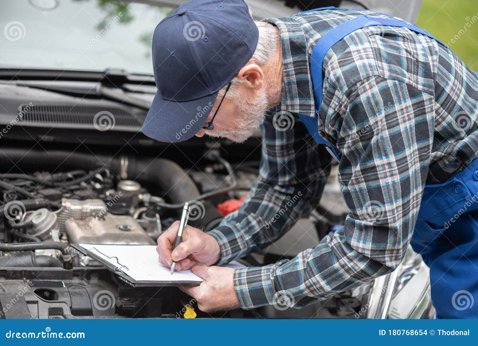 Car Mechanic Checking a Car Engine Stock Photo - Image of repairman ...