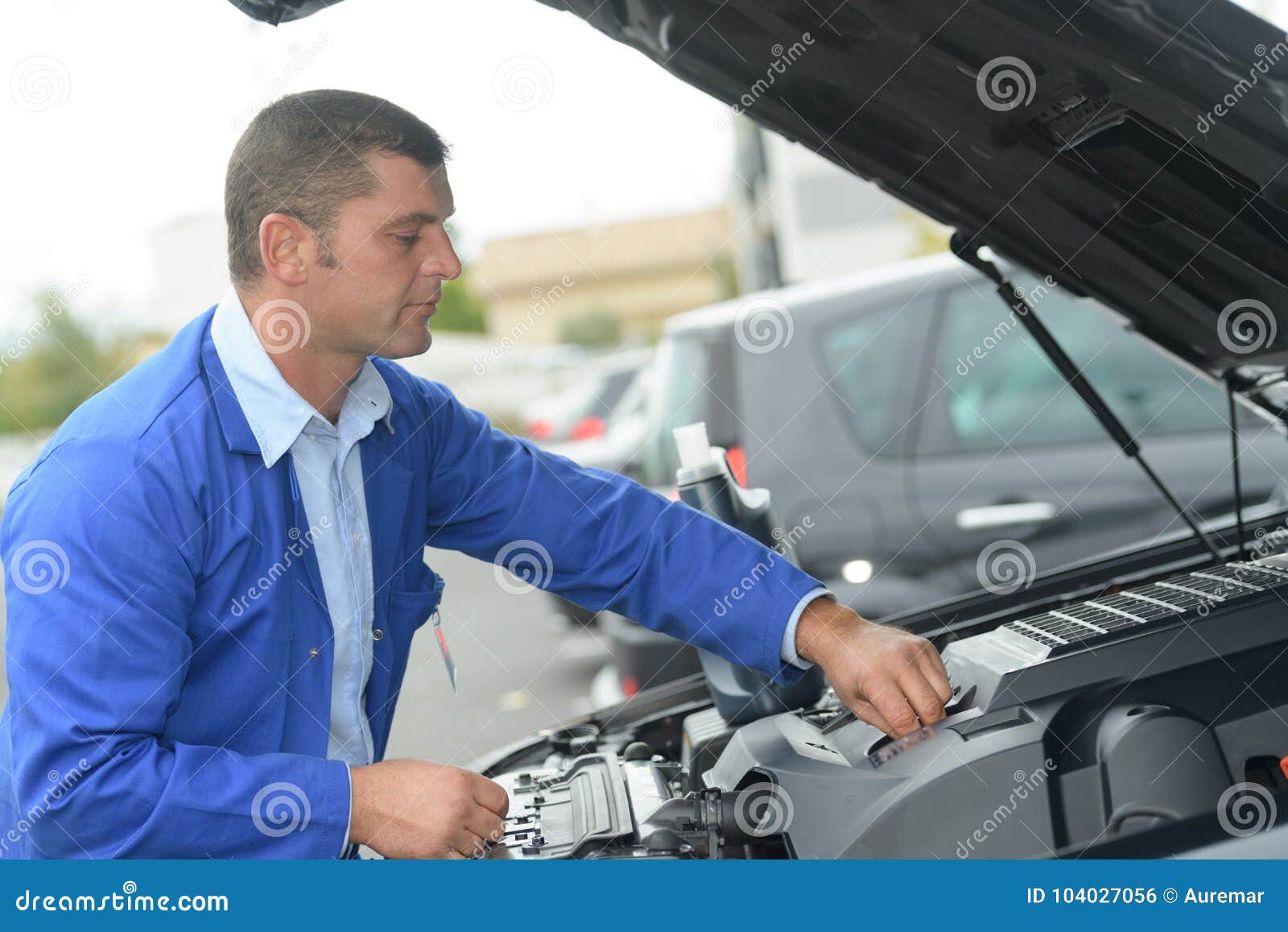 Car mechanic fixing engine stock photo. Image of space - 104027056