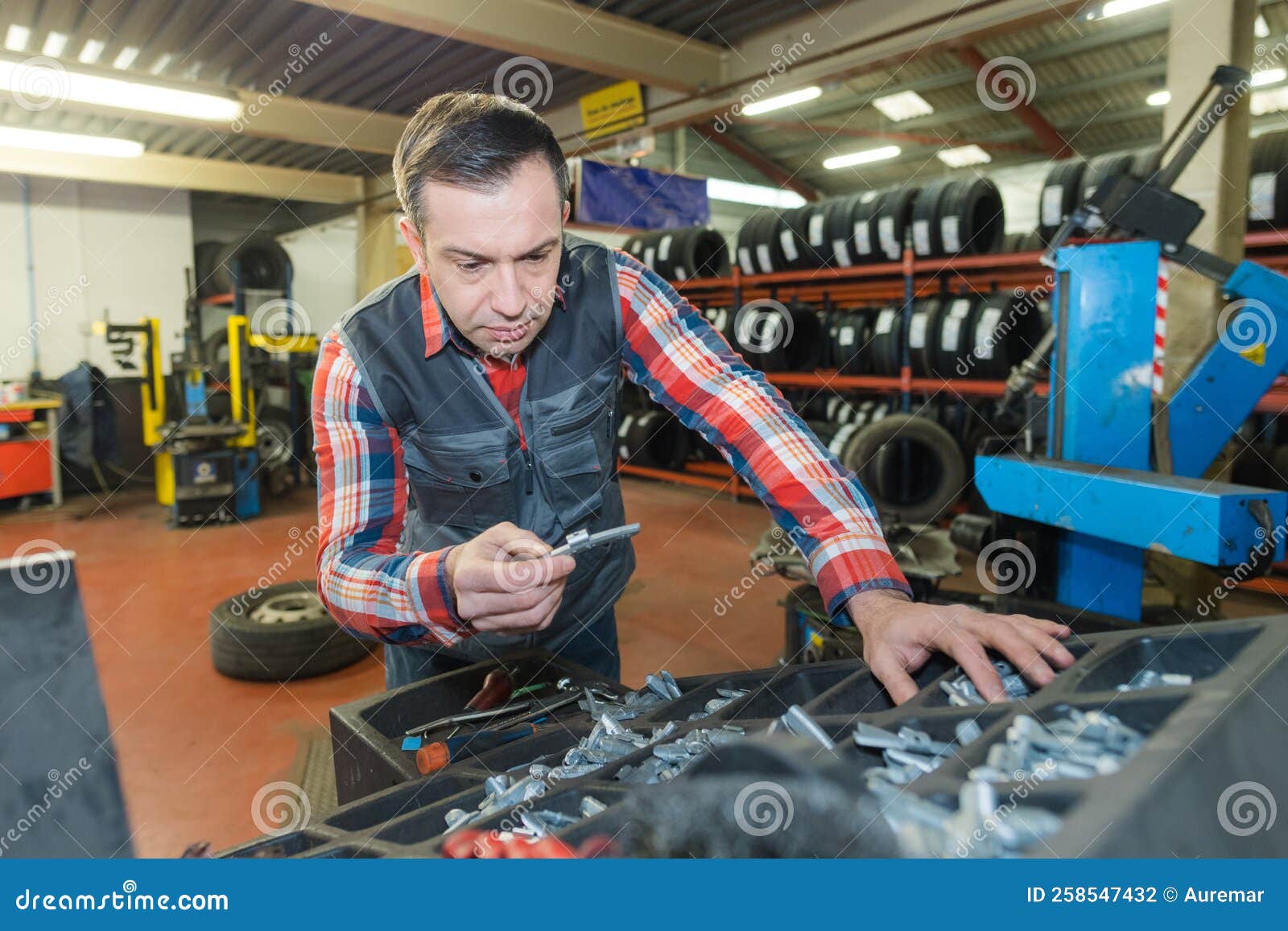 Car mechanic in garage stock photo. Image of repair - 258547432