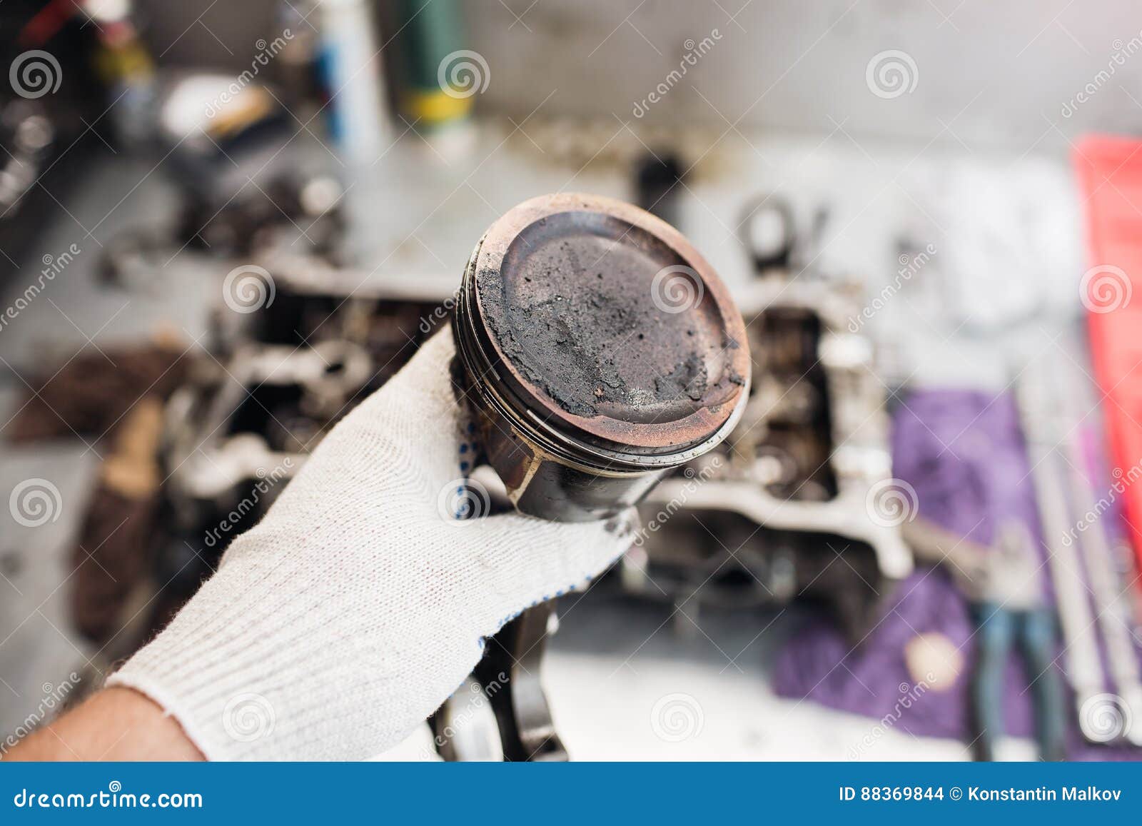 Car Mechanic in Garage with Old Car Engine Piston. Stock Photo - Image ...