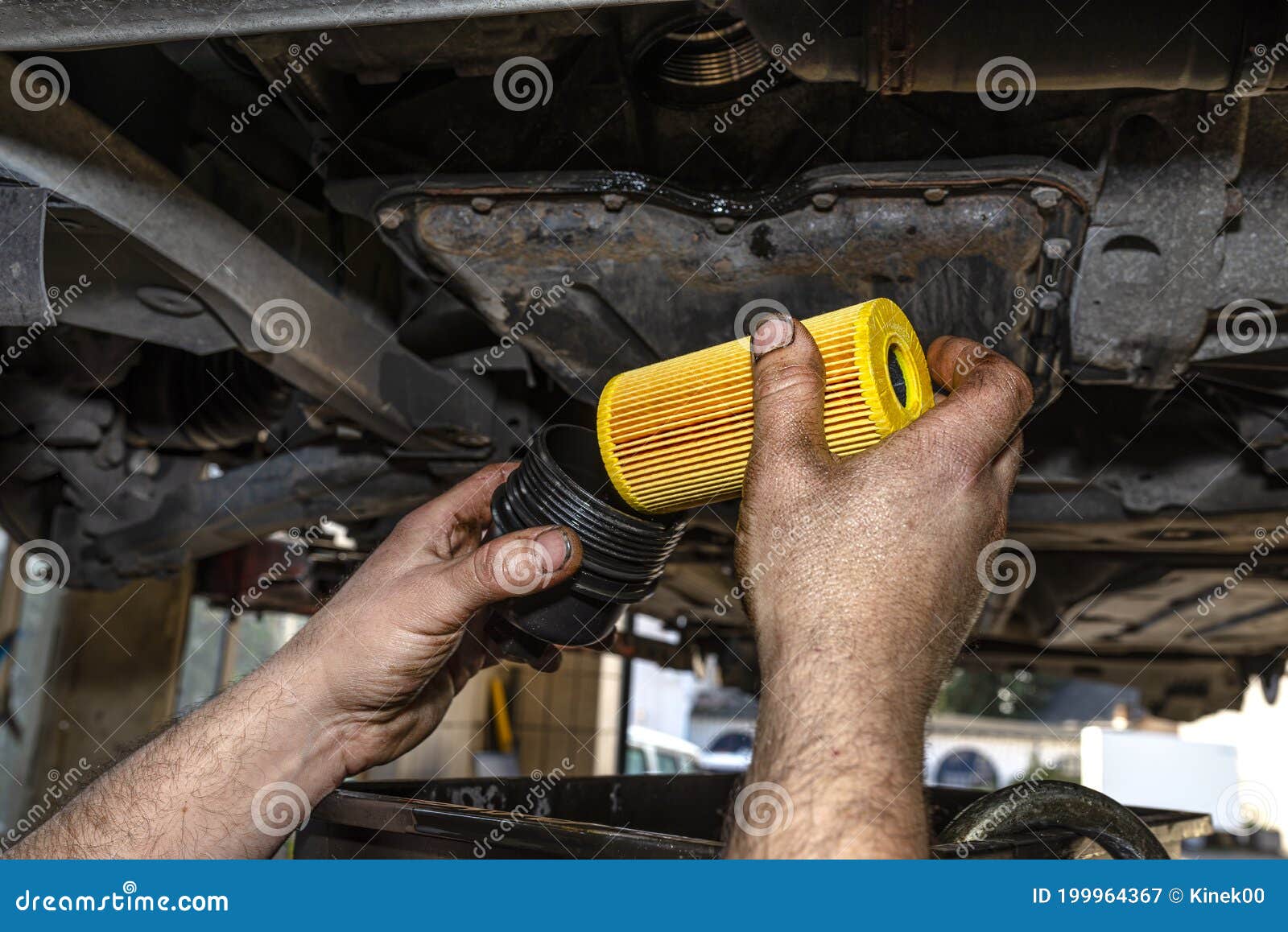Car Mechanic Holding a New Oil Filter for a Diesel Engine in the ...