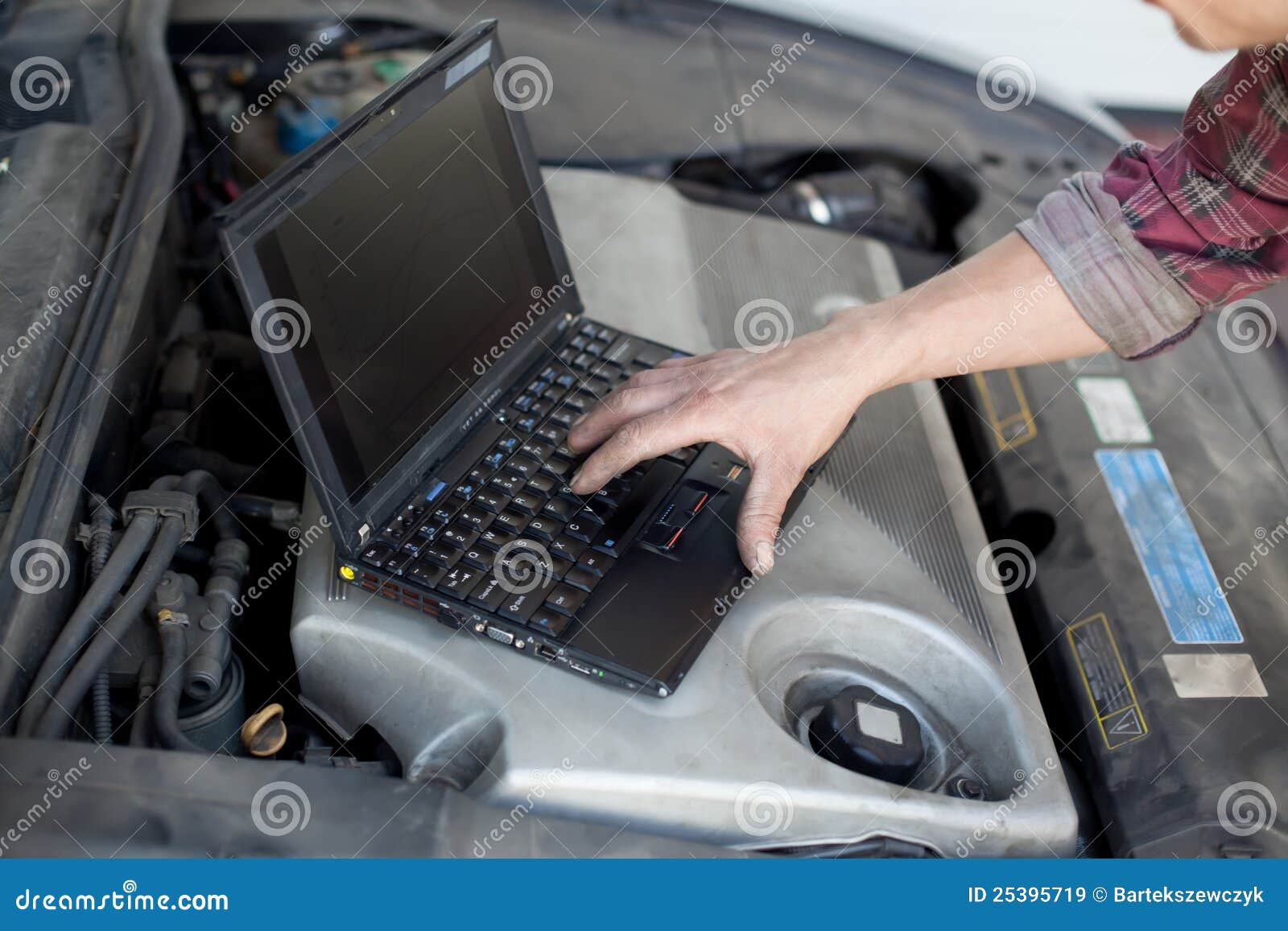 Car mechanic with laptop stock image. Image of service - 25395719