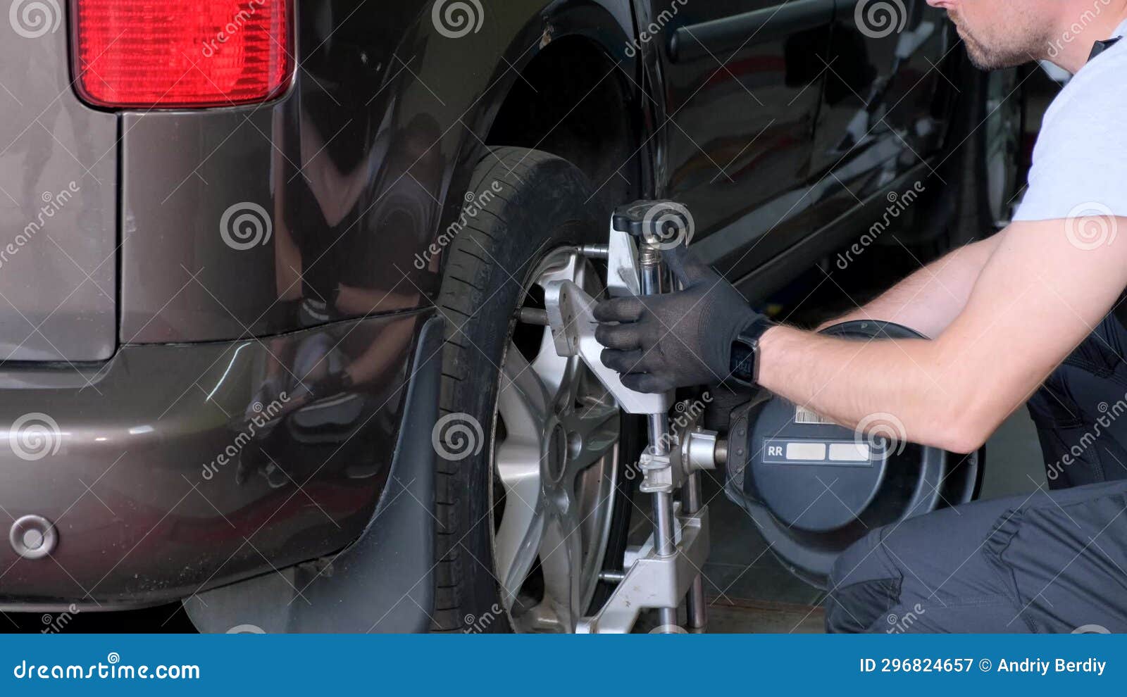 A Car Mechanic Makes a Camber of the Wheels in a Car Stock Video ...