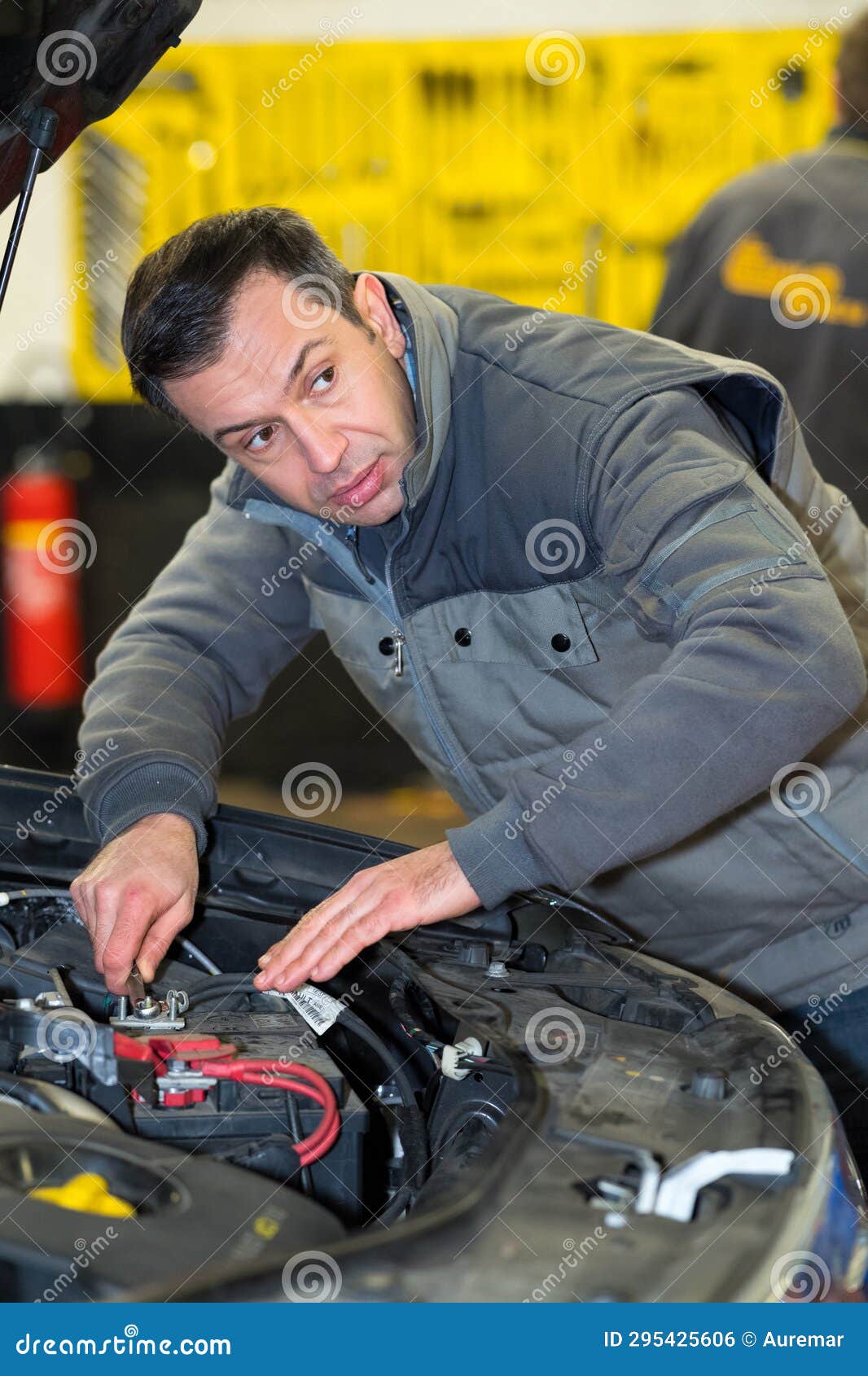 Car Mechanic Man at Garage Fixing Engine Stock Photo - Image of ...