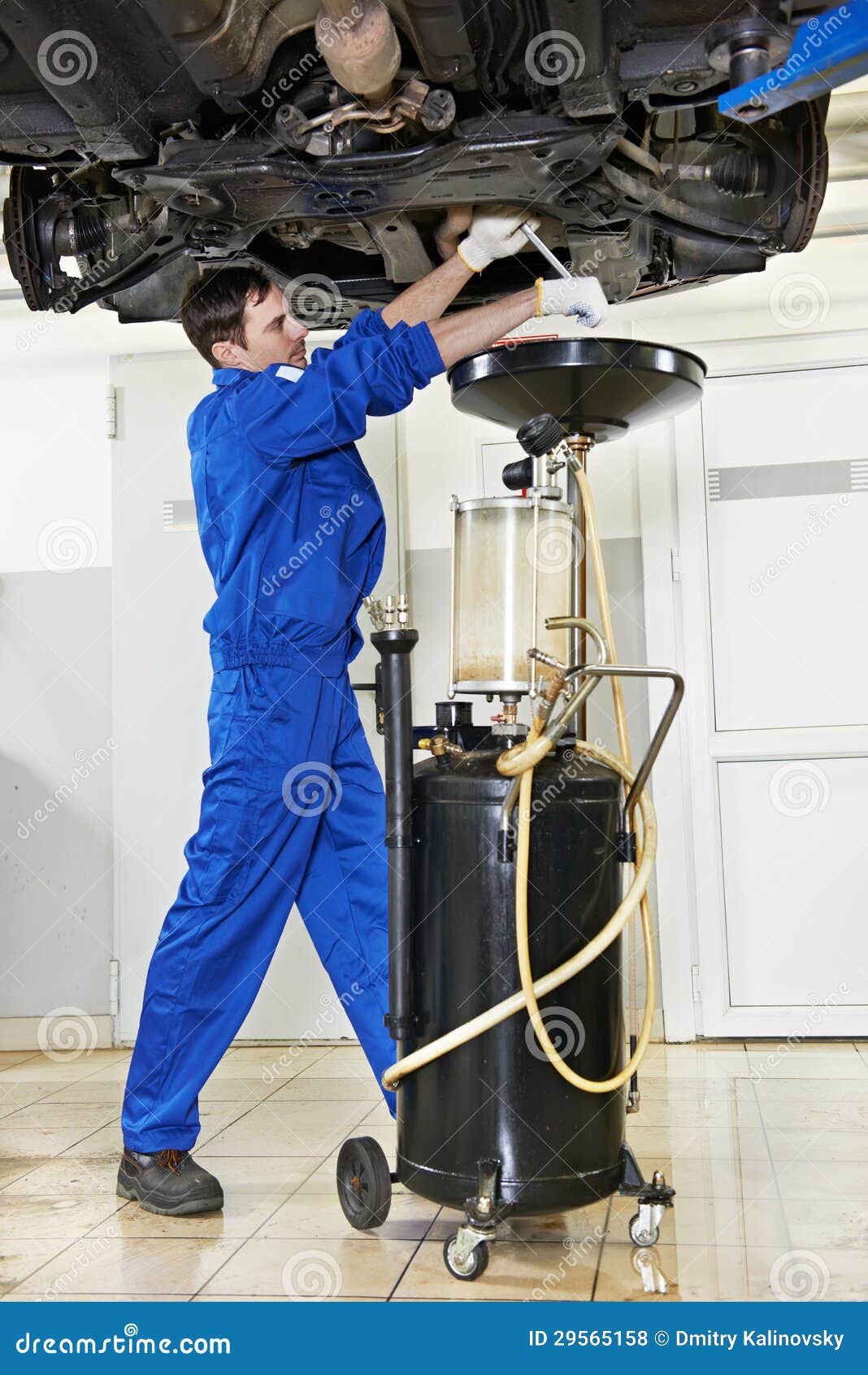 Car Mechanic Replacing Oil from Motor Engine Stock Photo - Image of ...