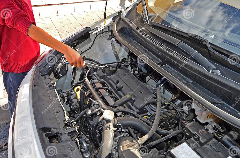 A Car Mechanic with a Spanner Stock Image - Image of group, greasy ...