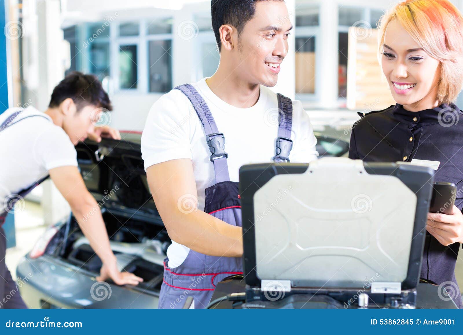 Car Mechanic Team with Diagnosis Tool in Workshop Stock Image - Image ...
