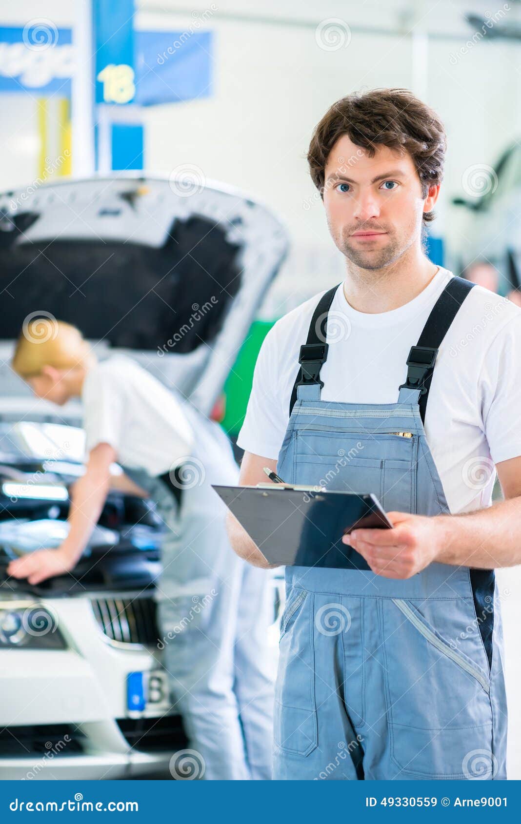 Car Mechanic Team Working in Auto Workshop Stock Image - Image of ...