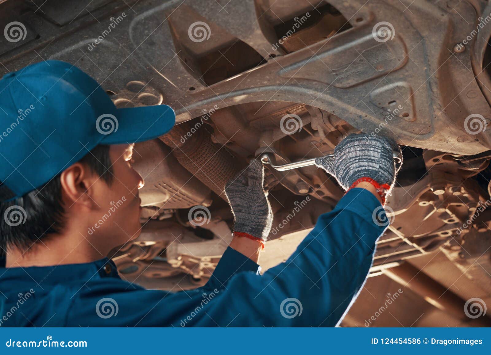 Mechanic tightening nut stock photo. Image of tightening - 124454586