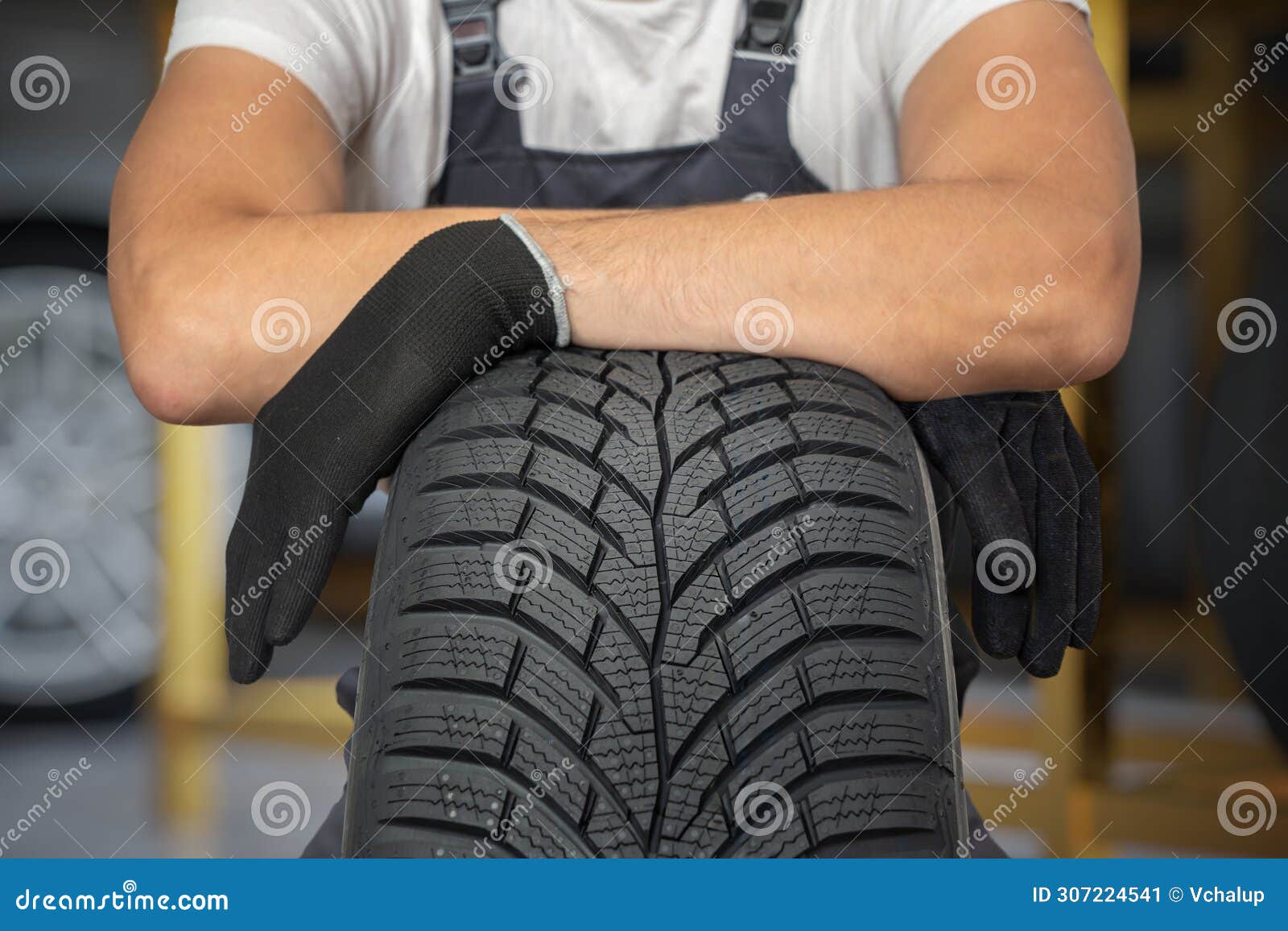 Car Mechanic with Tire in Garage Stock Image - Image of equipment ...