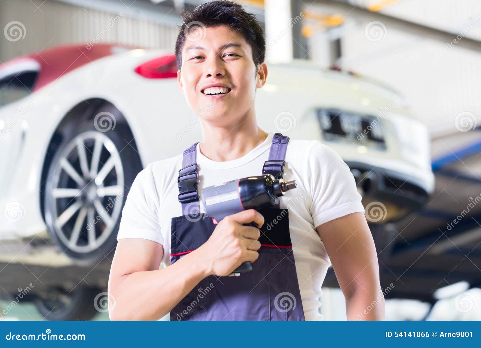 Car Mechanic with Tool in Asian Chinese Auto Workshop Stock Photo ...