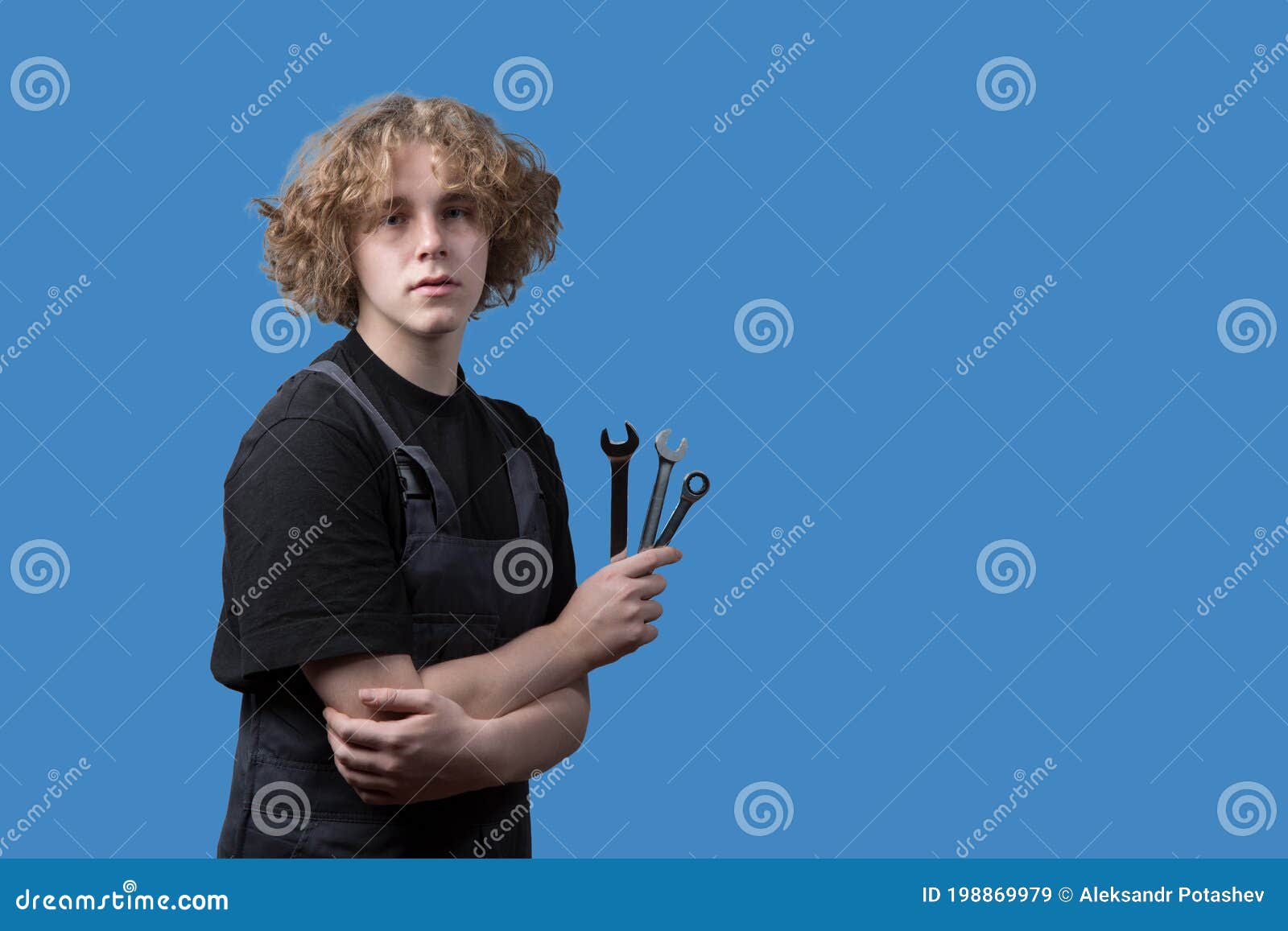 Car Mechanic with a Tool on a Blu Background Stock Image - Image of ...