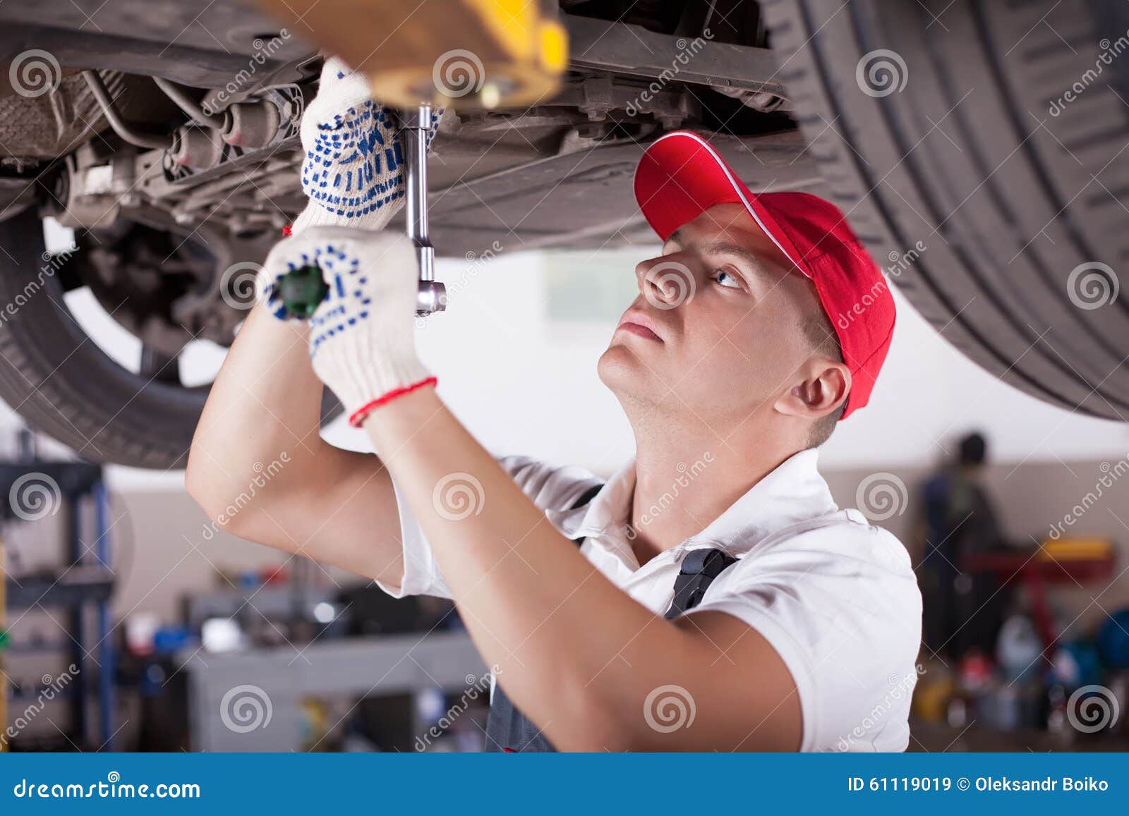 Car mechanic under a car stock image. Image of mechanic - 61119019